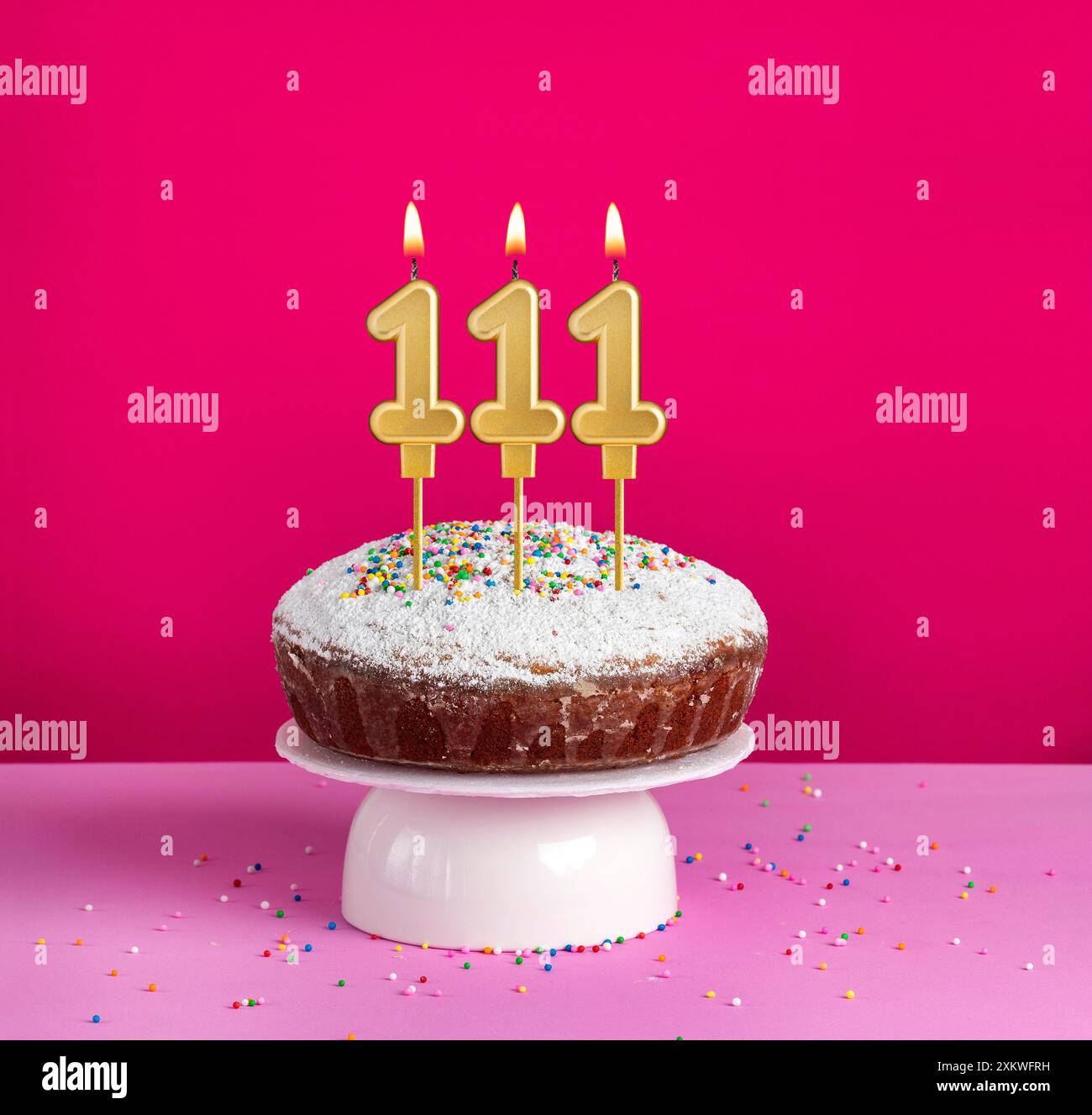 Birthday cake with number 111 candle on pink background Stock Photo - Alamy
