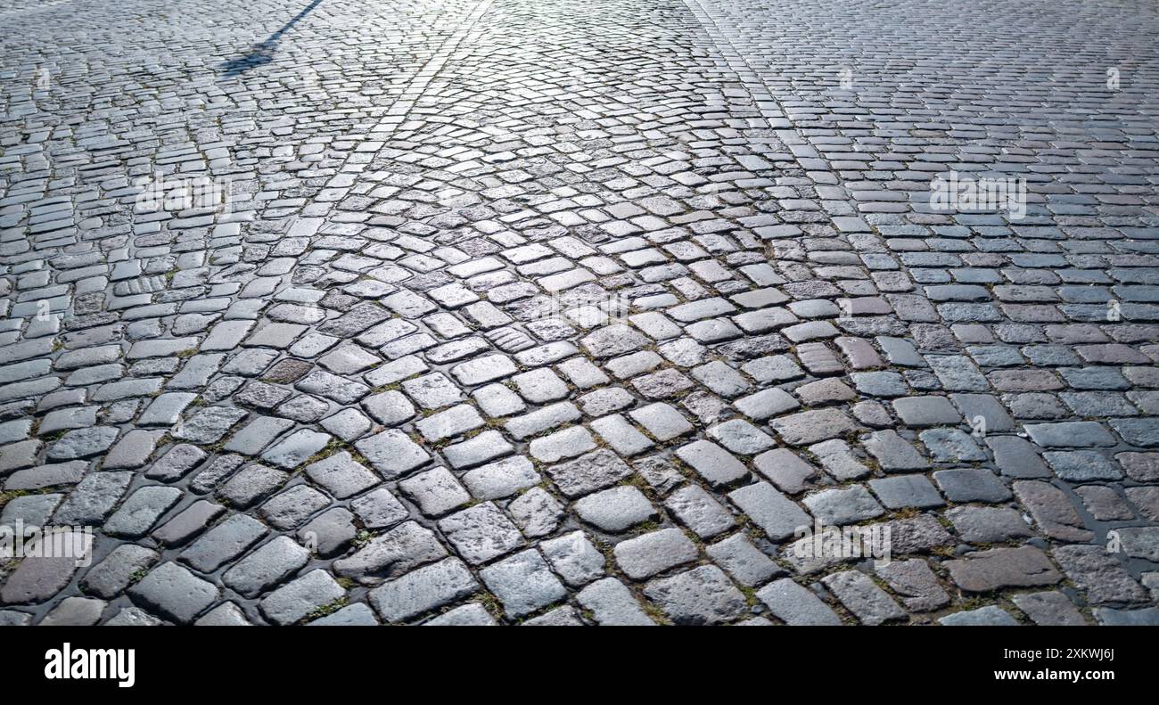 Pavement road. Background of bricks road. Stone cladding pavement ...