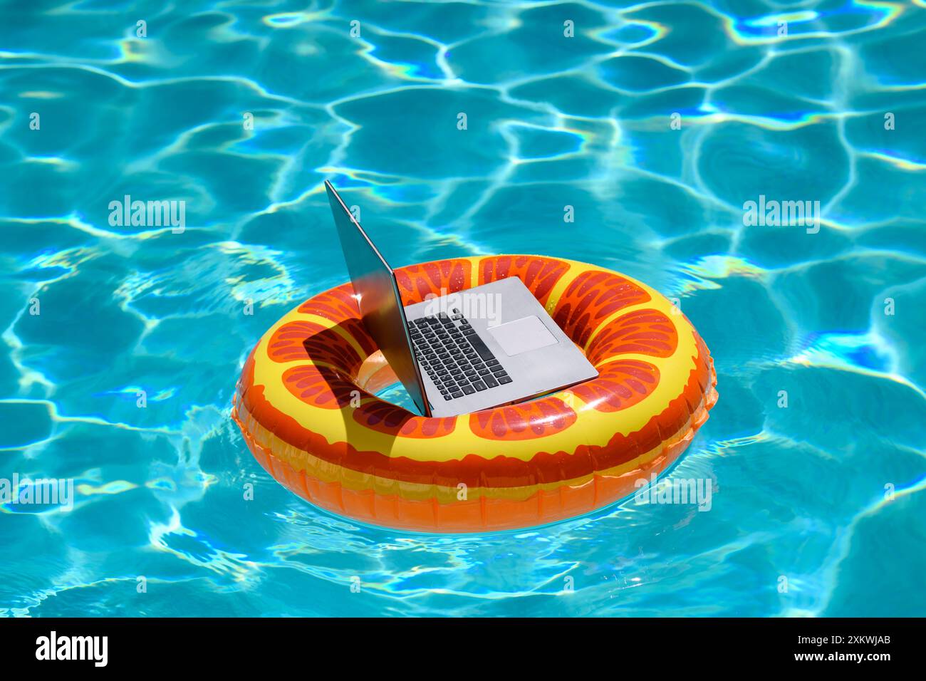 Summer business. Freelance style. Remote working in swimming pool ...