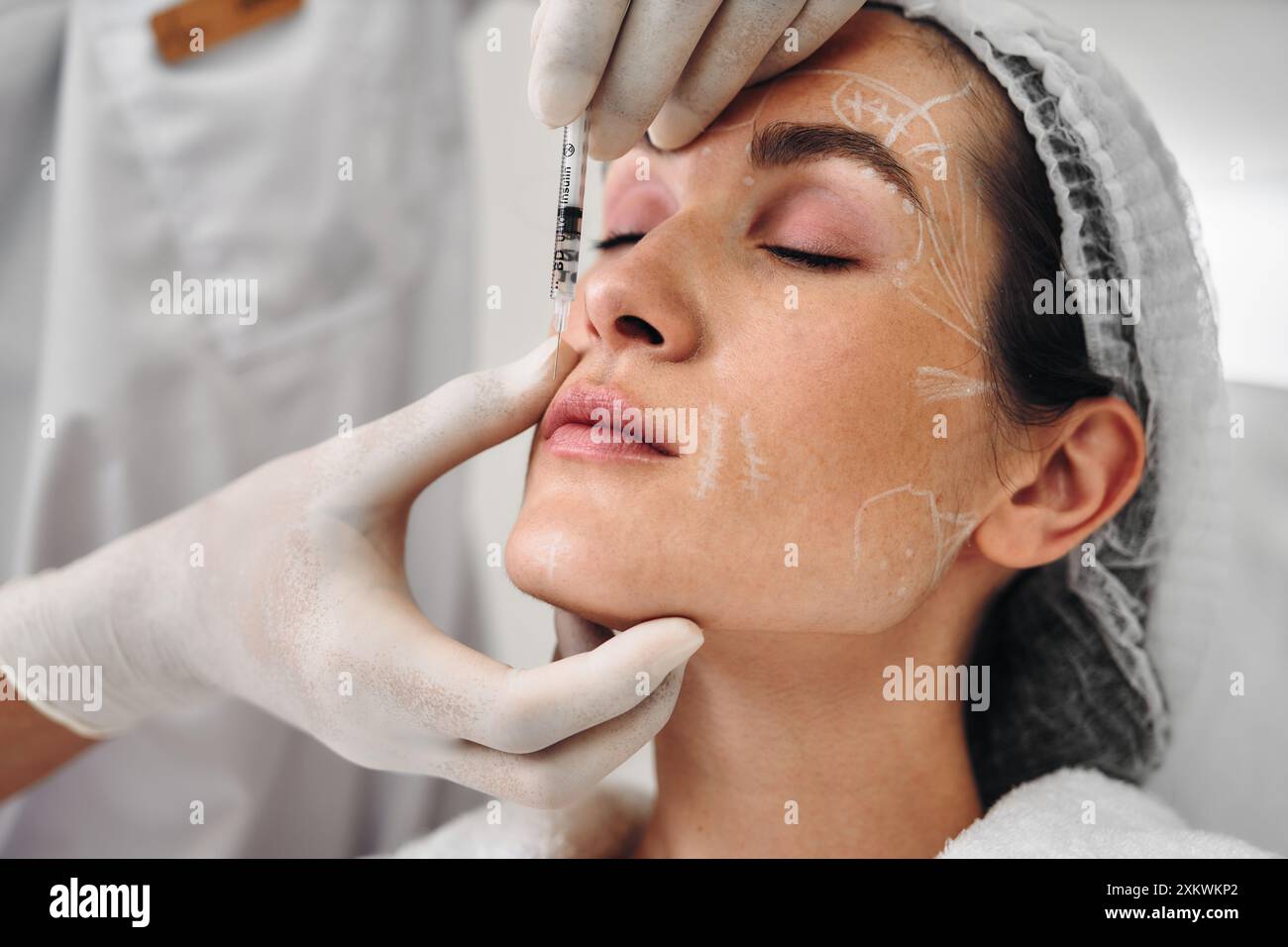 A woman gets injections in the face Stock Photo - Alamy