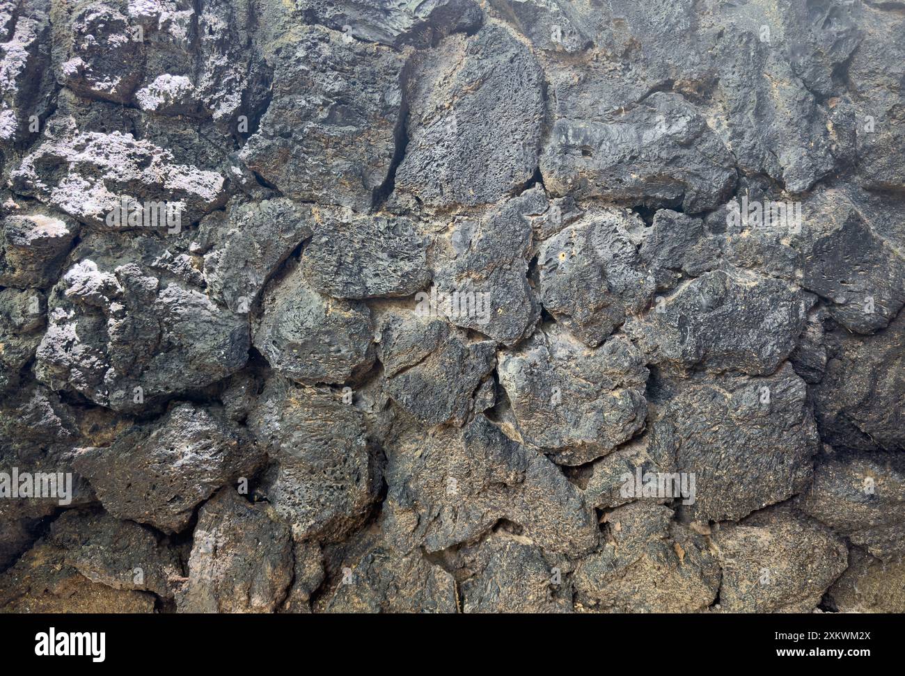 Black volcanic rock stone background close up view Stock Photo - Alamy