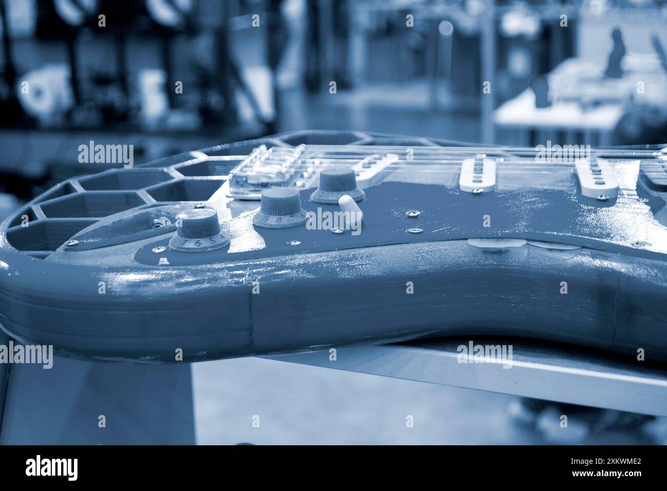 Musical instrument guitar 3D printed from molten plastic in yellow and ...