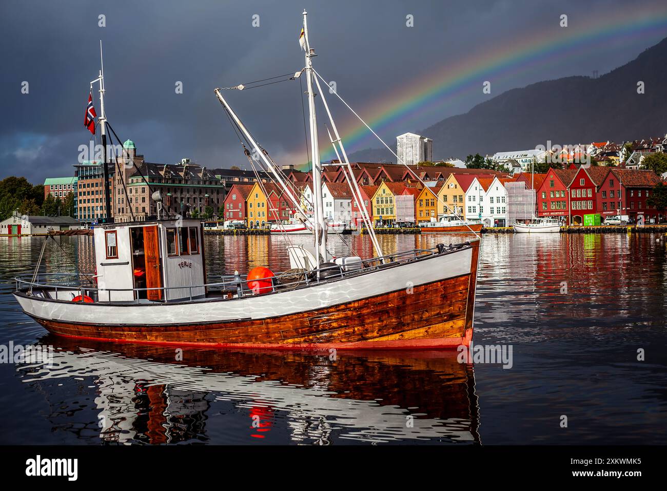 Fishing boat with a rainbow at Bryggen in Bergen, Norway Stock Photo ...