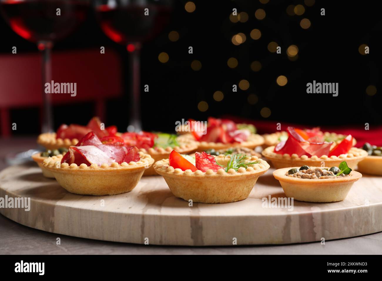 Delicious canapes with jamon and pate on grey table, closeup Stock ...