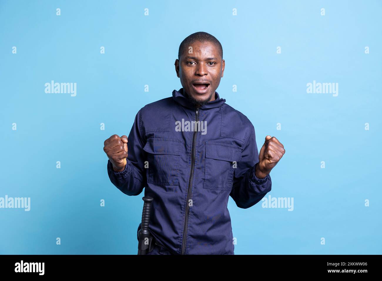 African american agent with uniform acting shocked in studio, having a ...