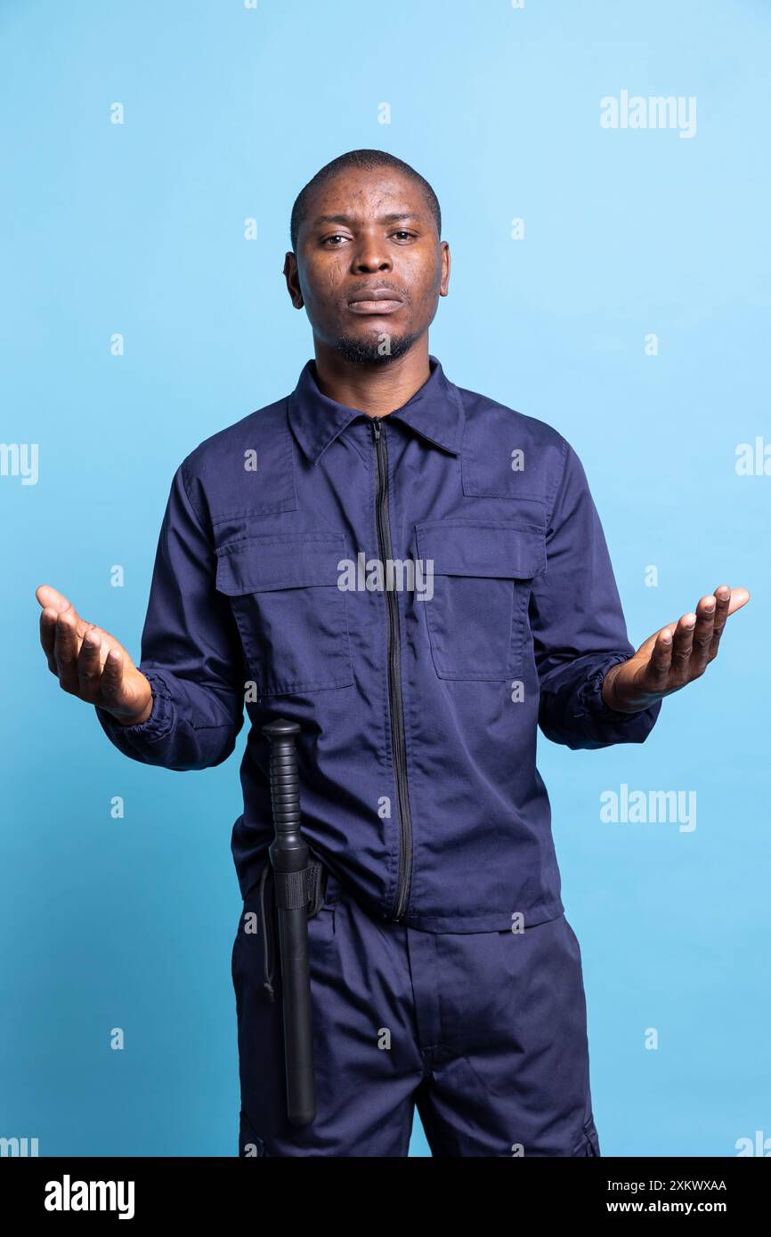 Security guard showing faith in Jesus Christ and praying in studio ...