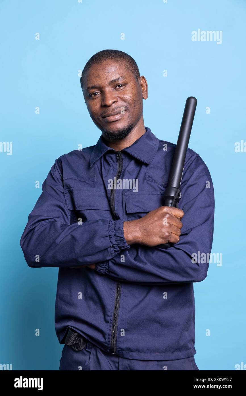 African american security guard feels proud with his police weapon on ...