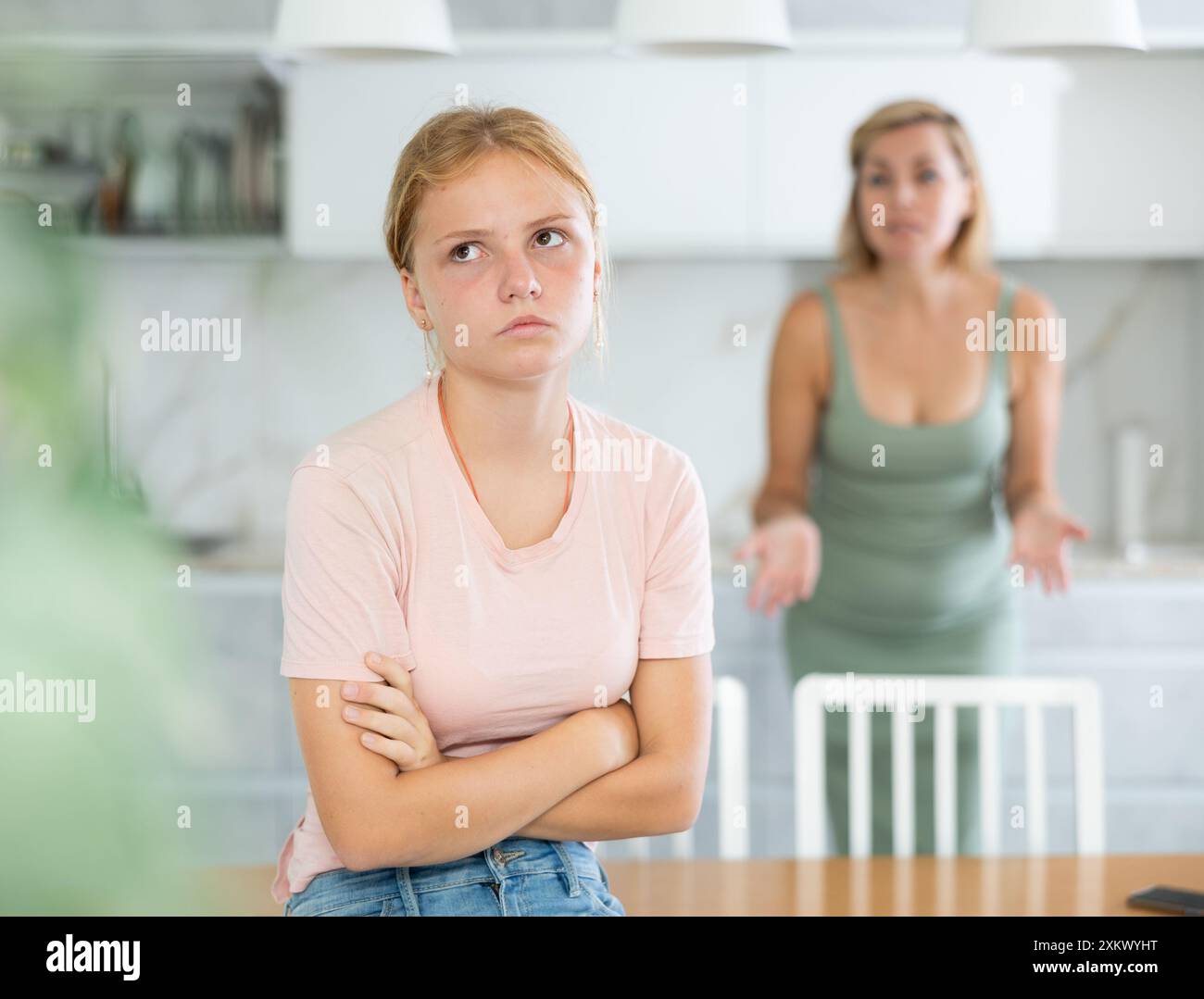 Angry mother yells at teenage girl sad daughter Stock Photo - Alamy