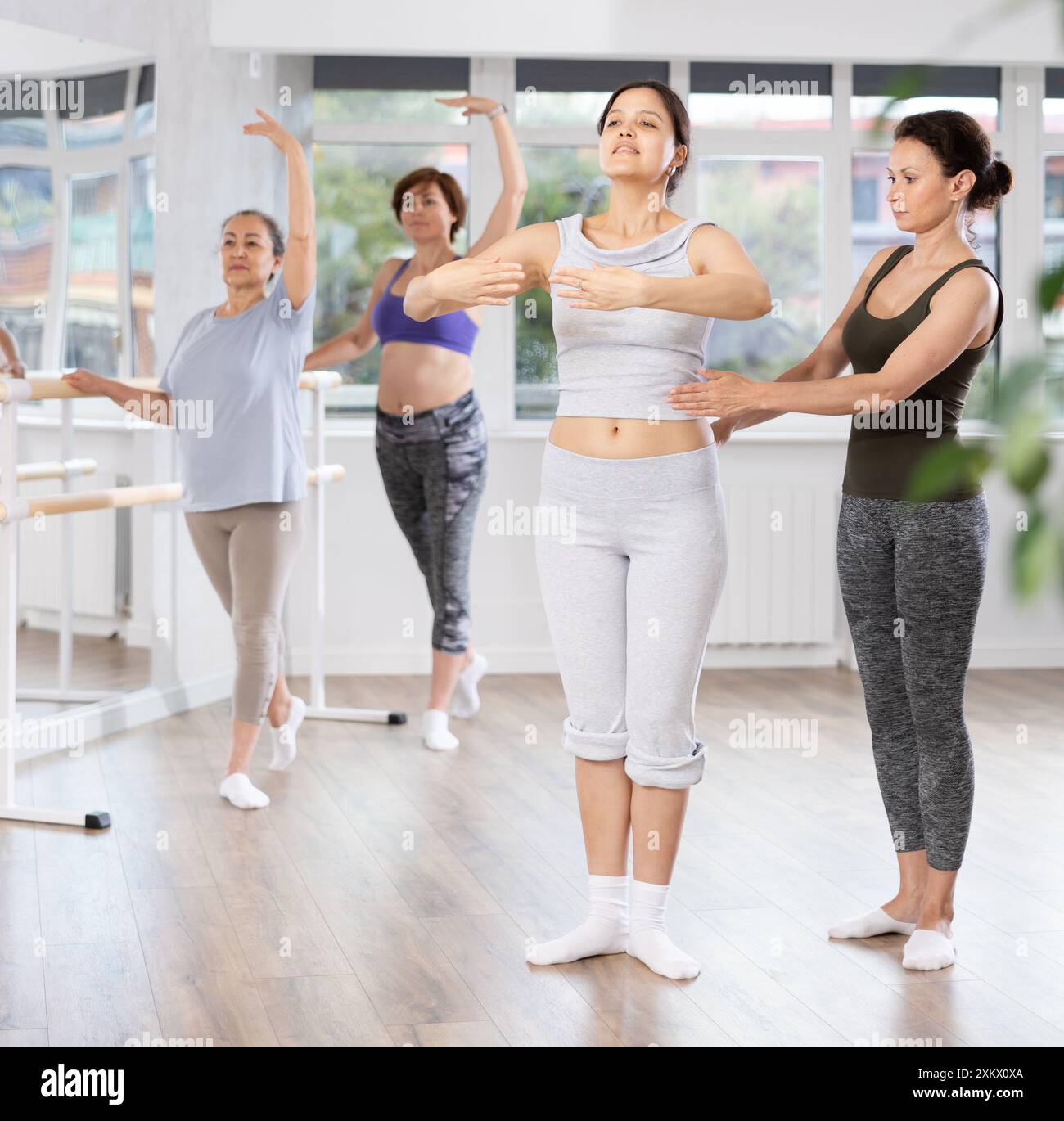 Ballet lesson for amateurs - choreographer teaches women of different ...
