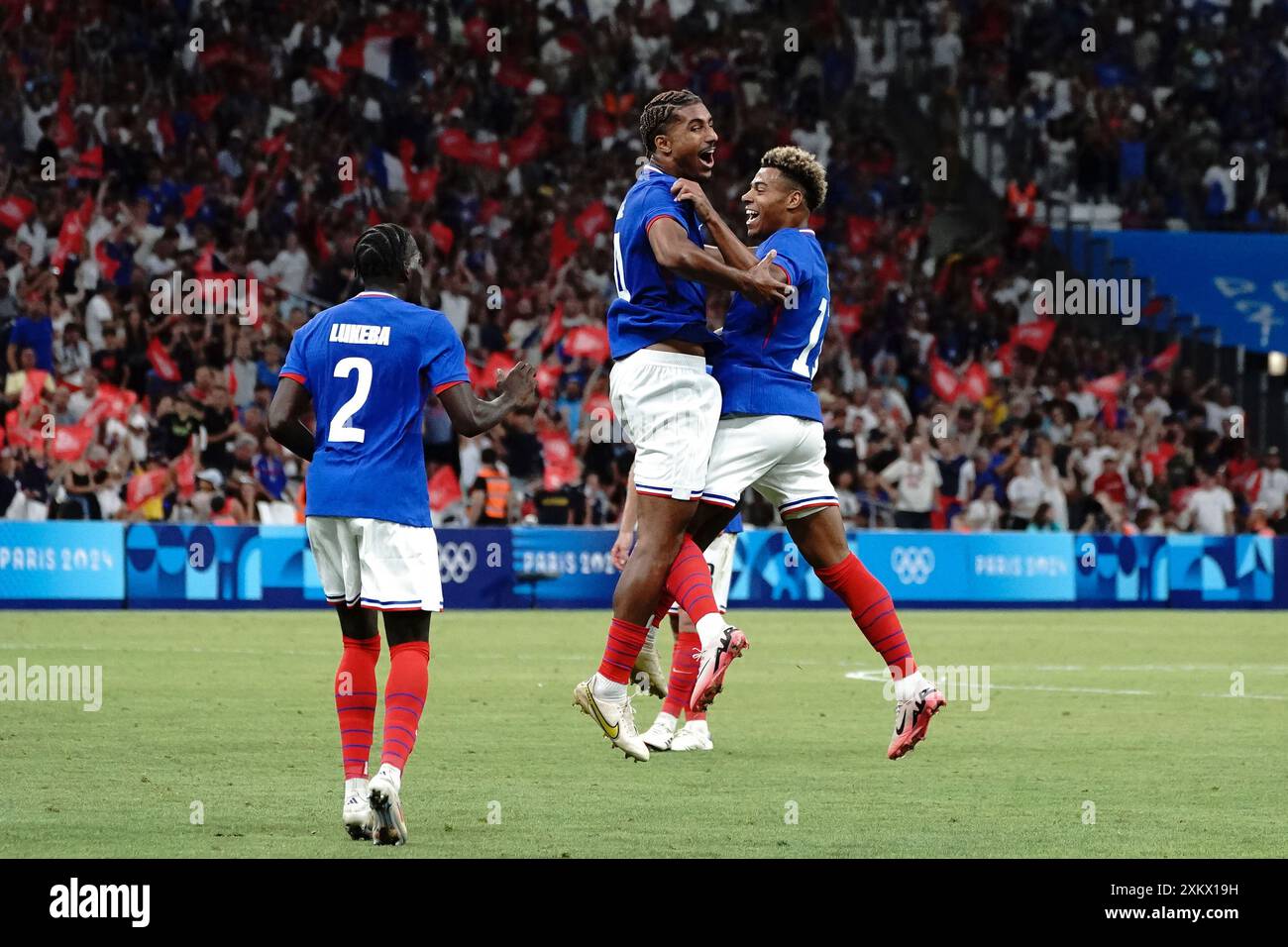 Loic Bade (France) celebrates his goal with Desire Doue (France) and ...