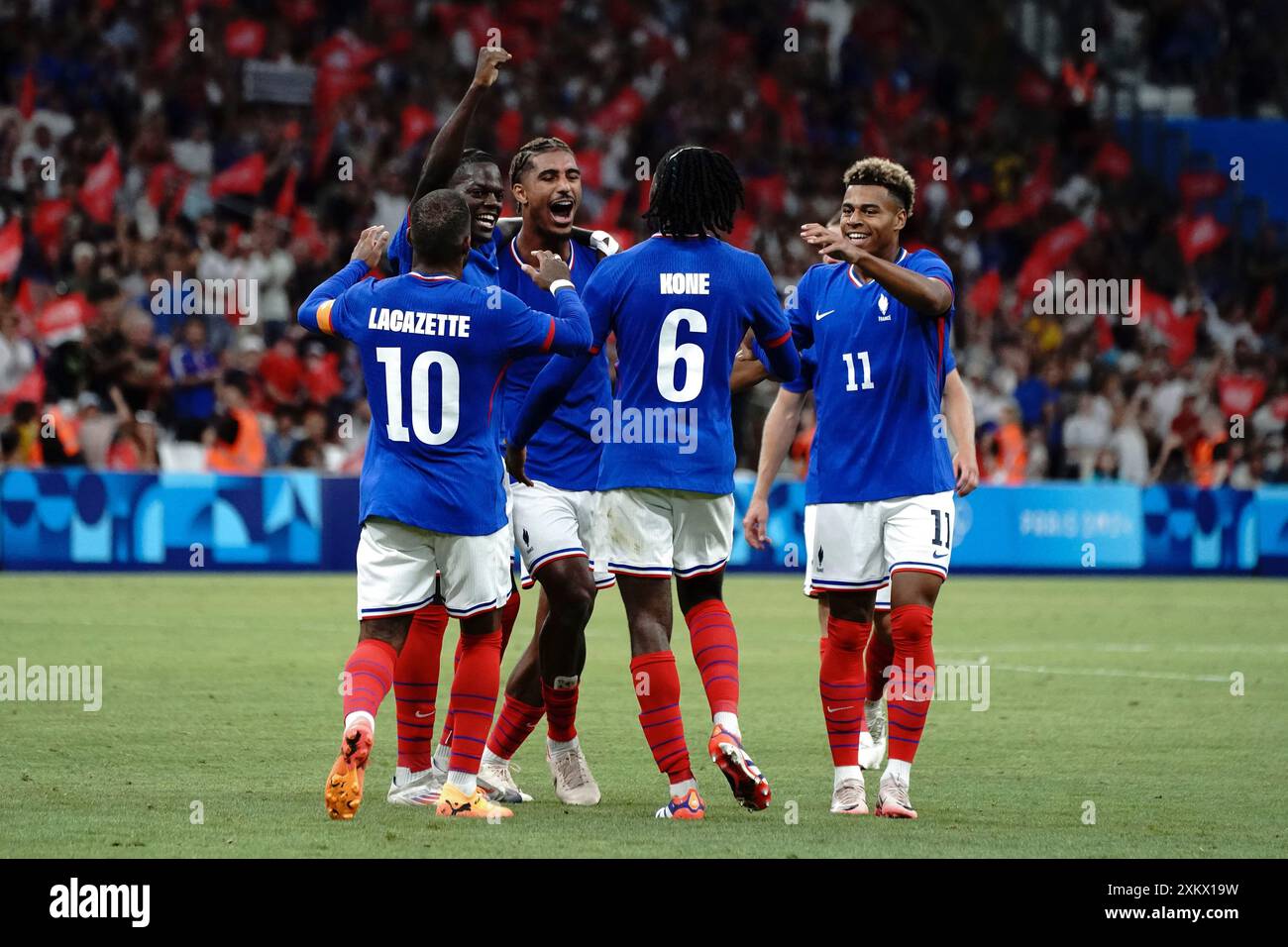 Loic Bade (France) celebrates his goal with teammates during the ...