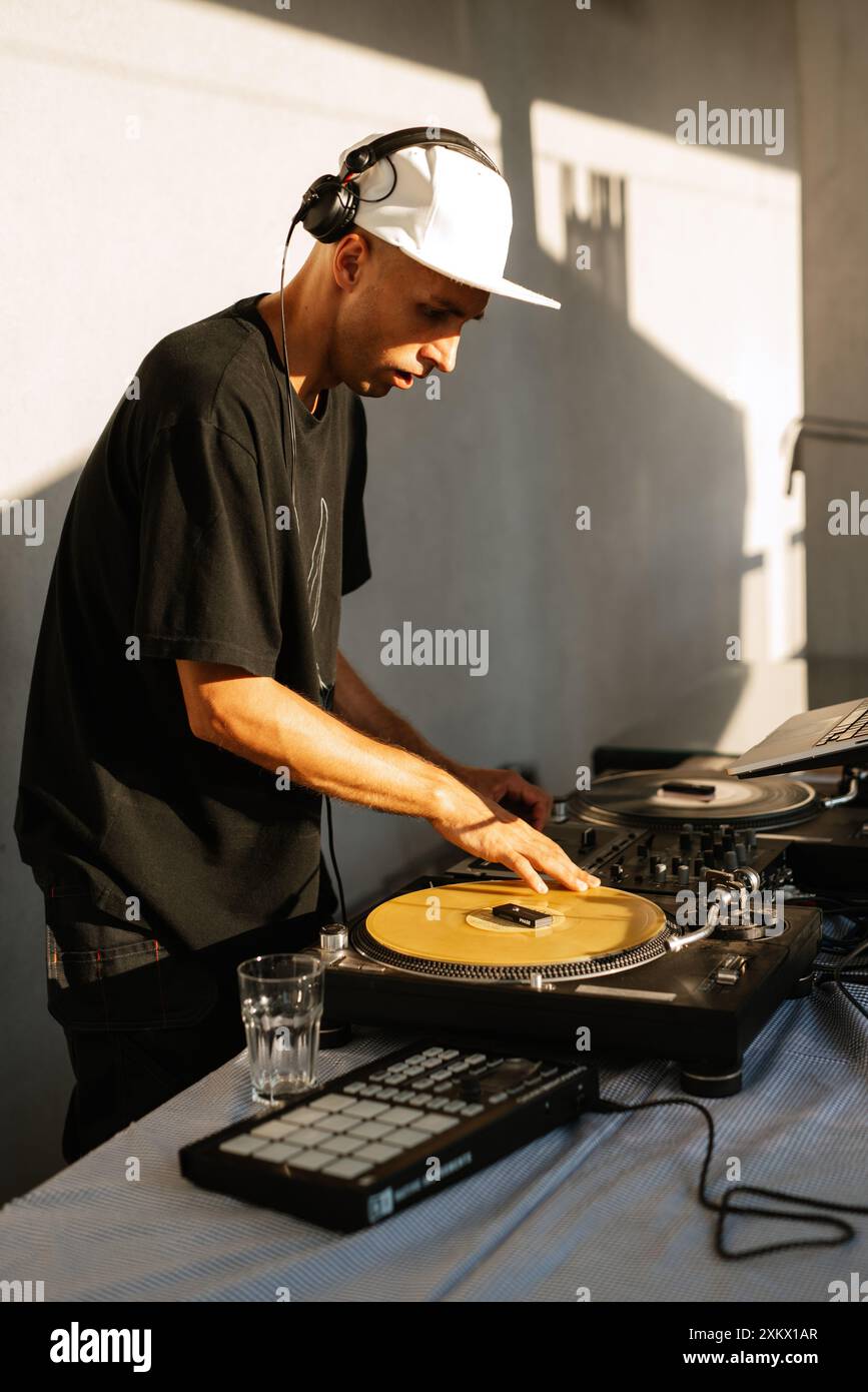 DJ on stage at a concert puts and mixes tracks Stock Photo - Alamy