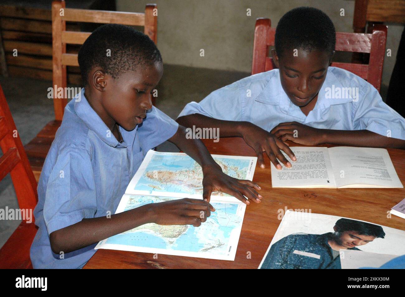 Schoolchildren reading books, Uganda, Africa Stock Photo - Alamy