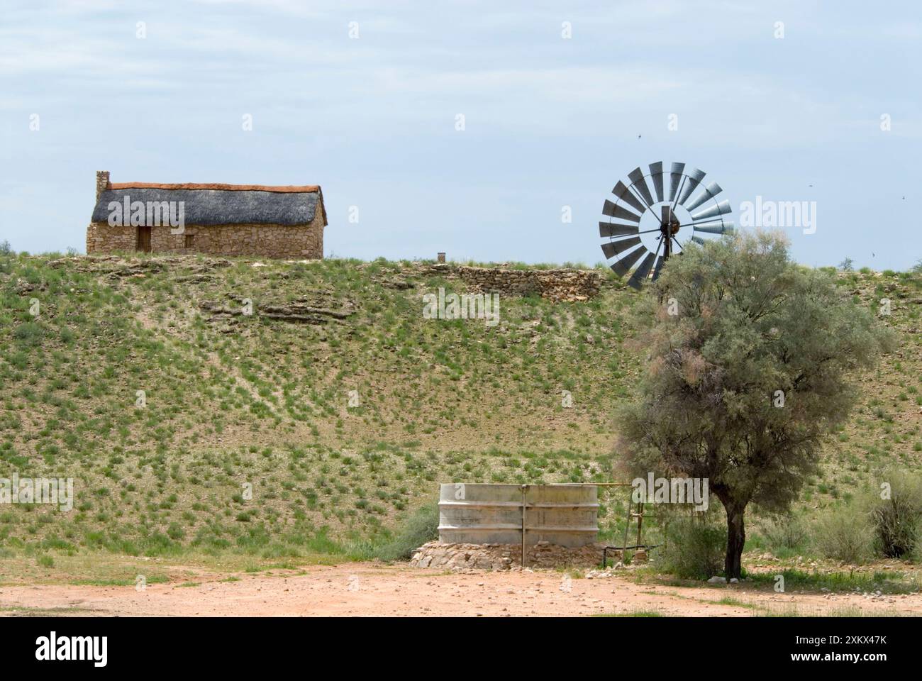 Restored waterhole / watcher's farm house, built Stock Photo - Alamy