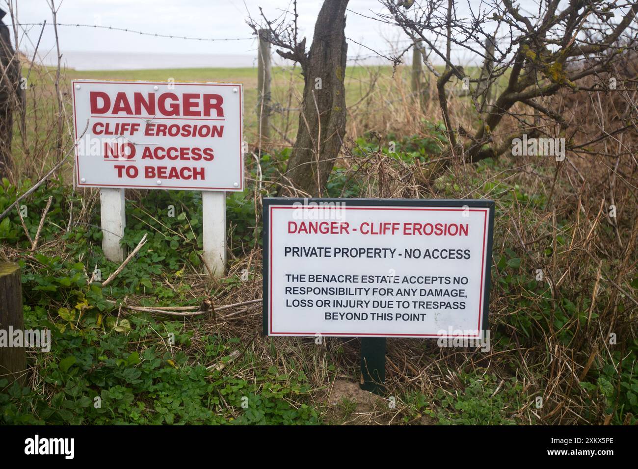 Signs at Covehithe telling of the danger of cliff erosion Stock Photo ...