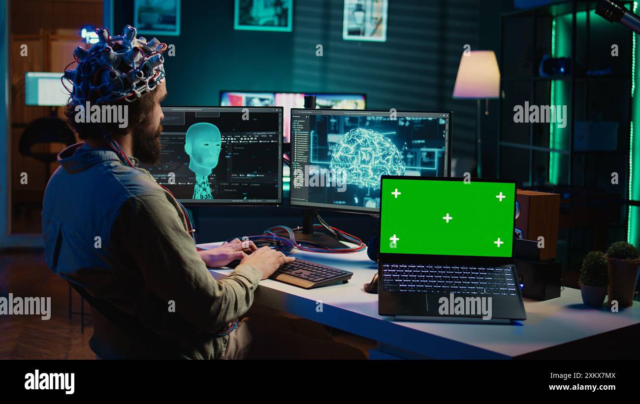 Computer scientist uploading brain into cyberspace, gaining digital persona using green screen ...