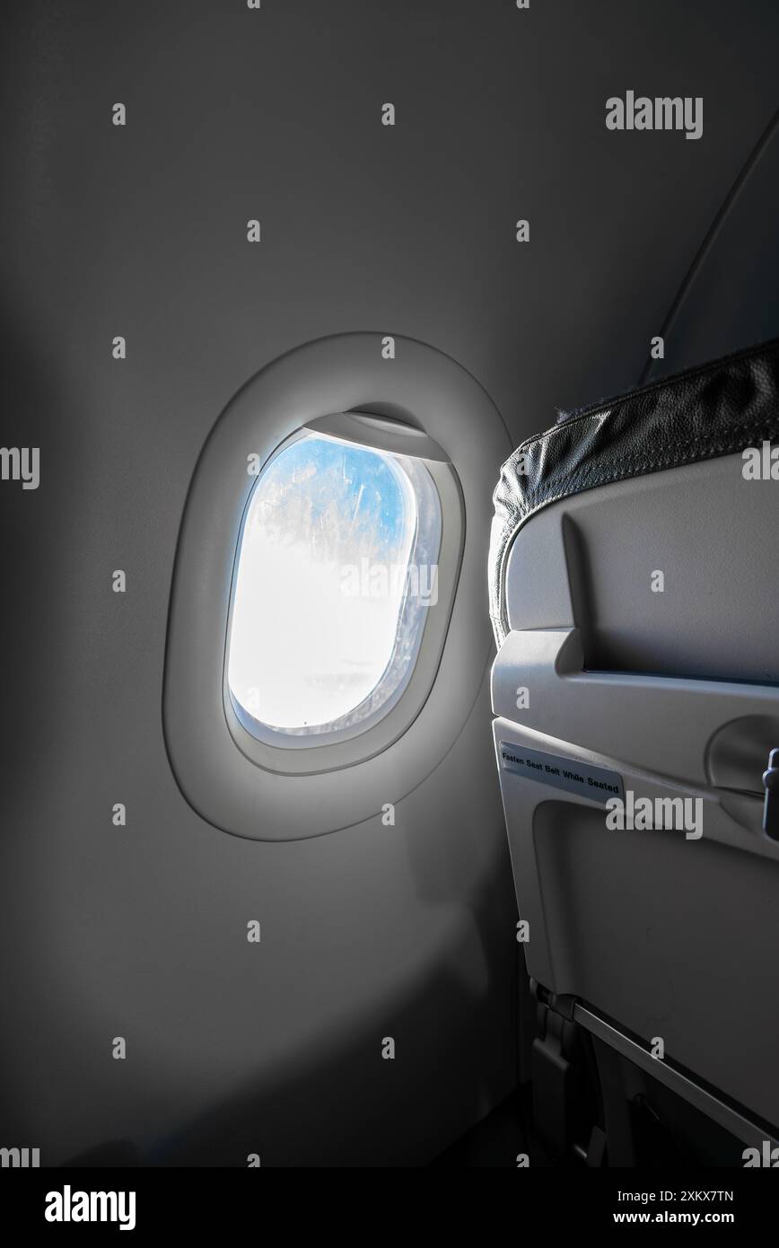 Airplane window. View from inside the cabin Stock Photo - Alamy