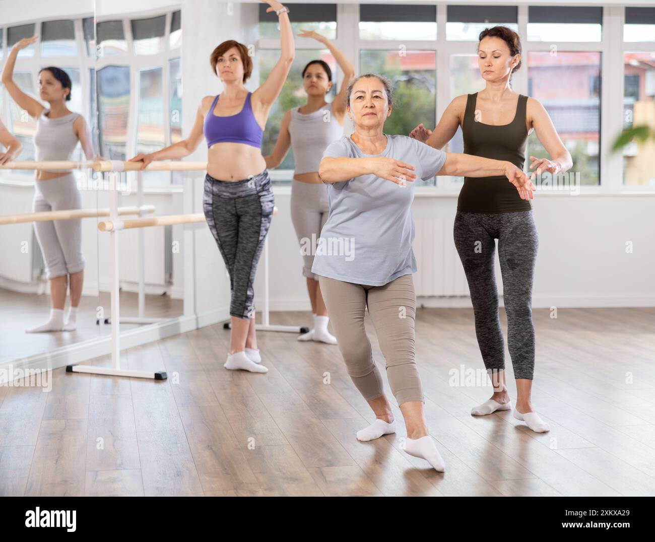 Ballet lesson for amateurs - choreographer teaches women of different ...