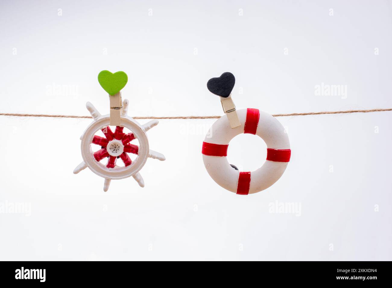Life preserver and Steering wheel attached to a string Stock Photo - Alamy