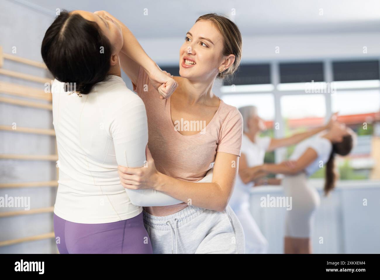 Two young women training self-defense techniques Stock Photo - Alamy