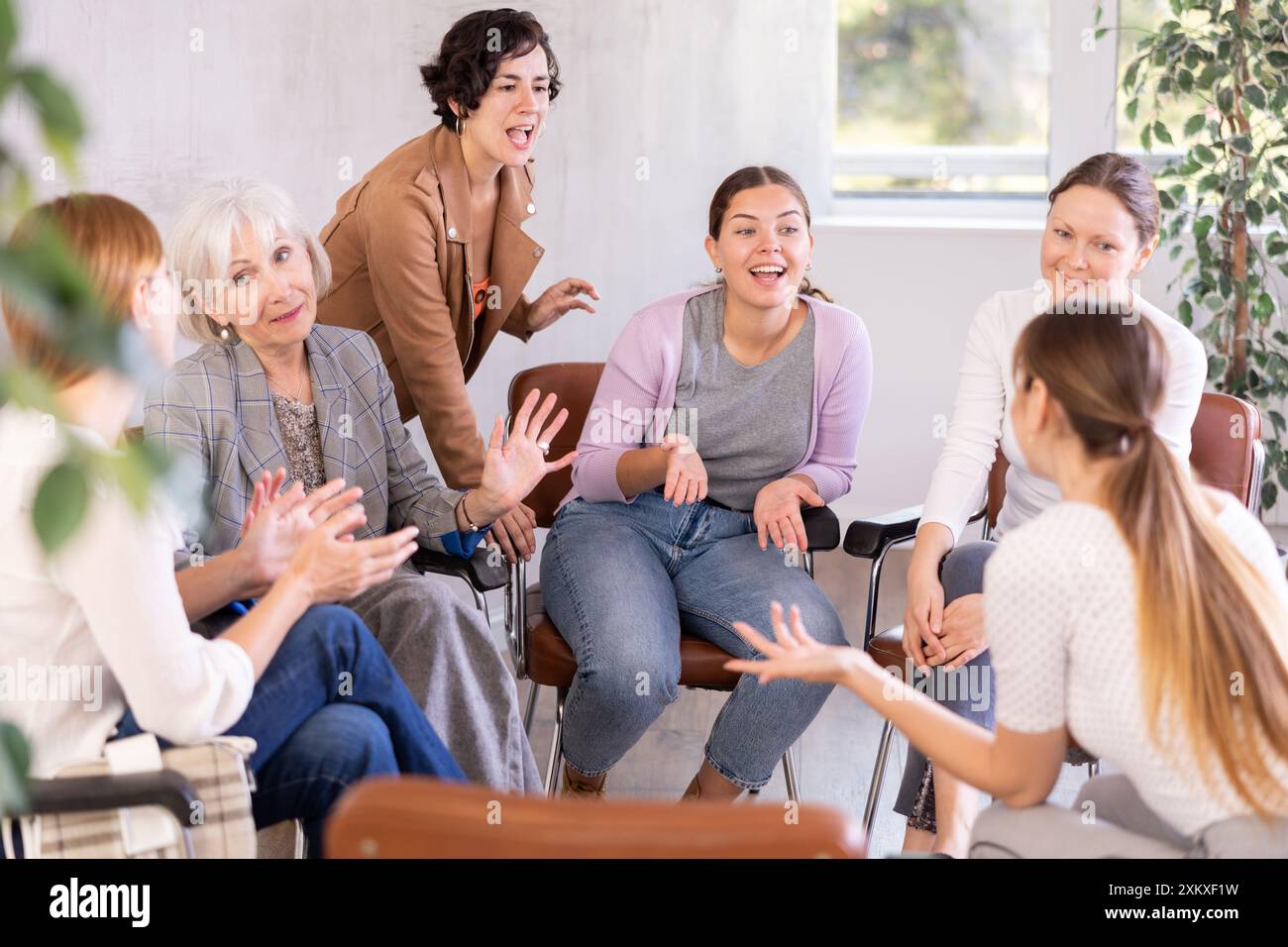 in group lesson, students are animatedly discussing ways to perform ...