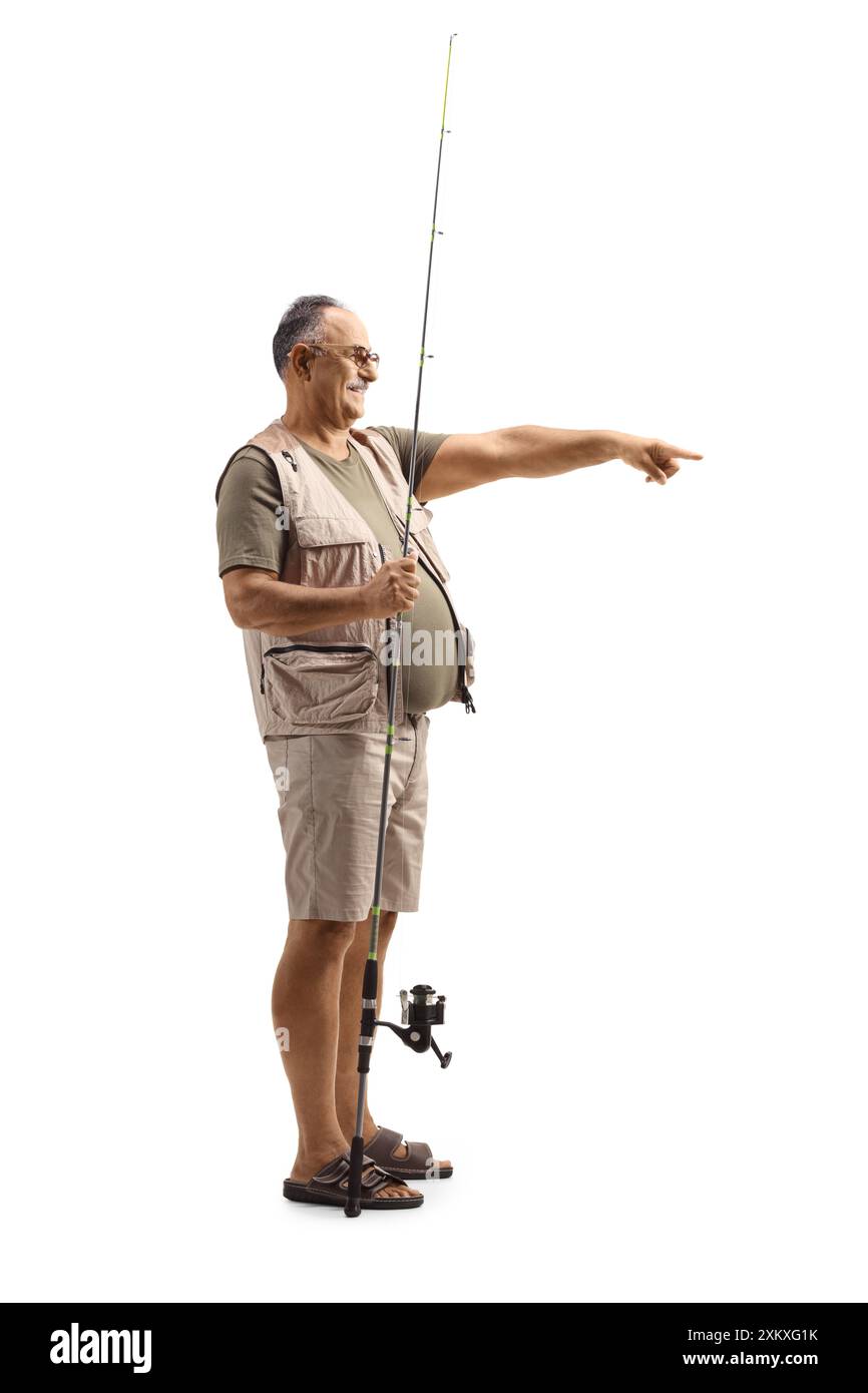 Full length profile shot of a fisherman with a fishing rod pointing ...