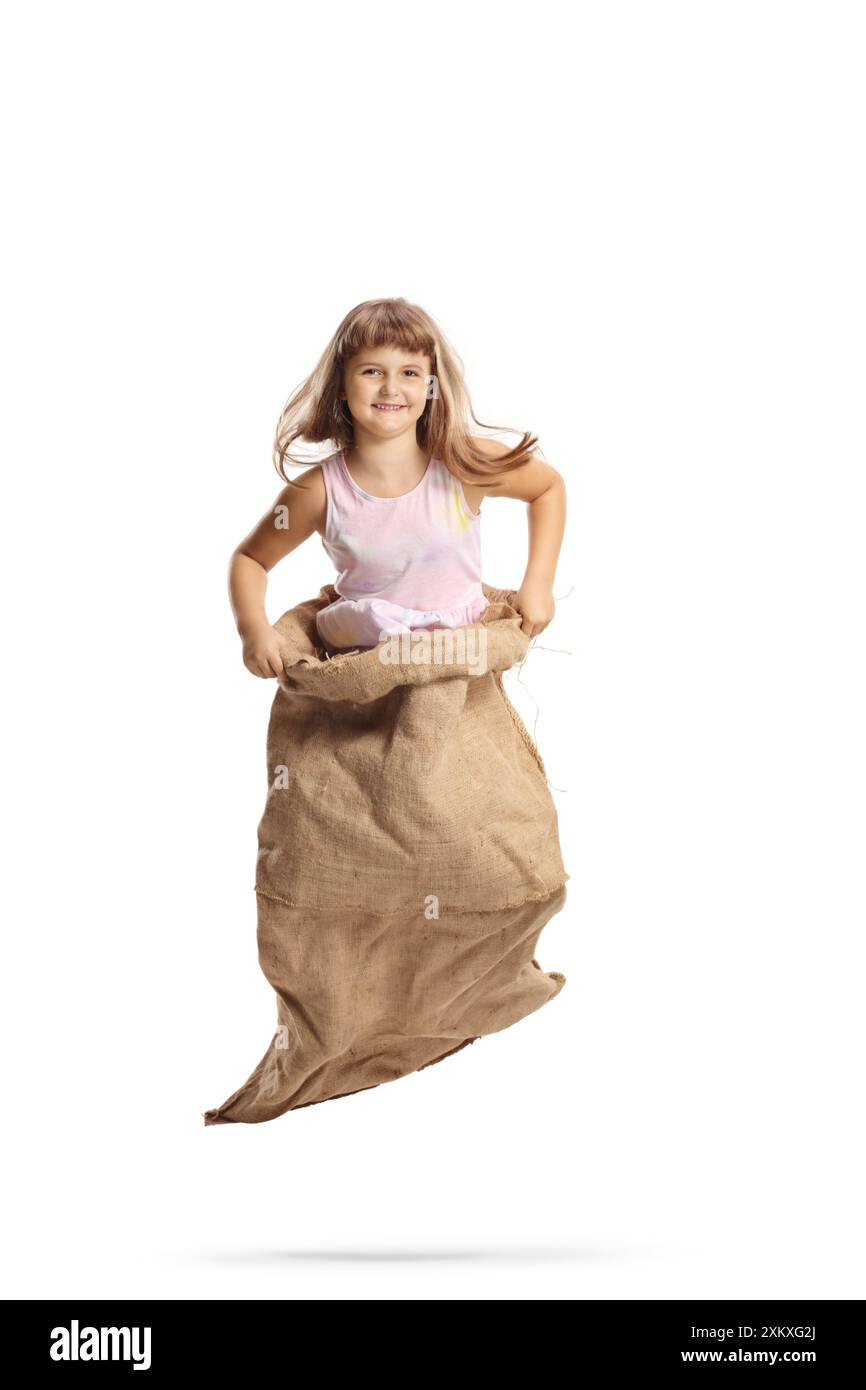 Happy girl jumping in a sack isolated on white background Stock Photo ...