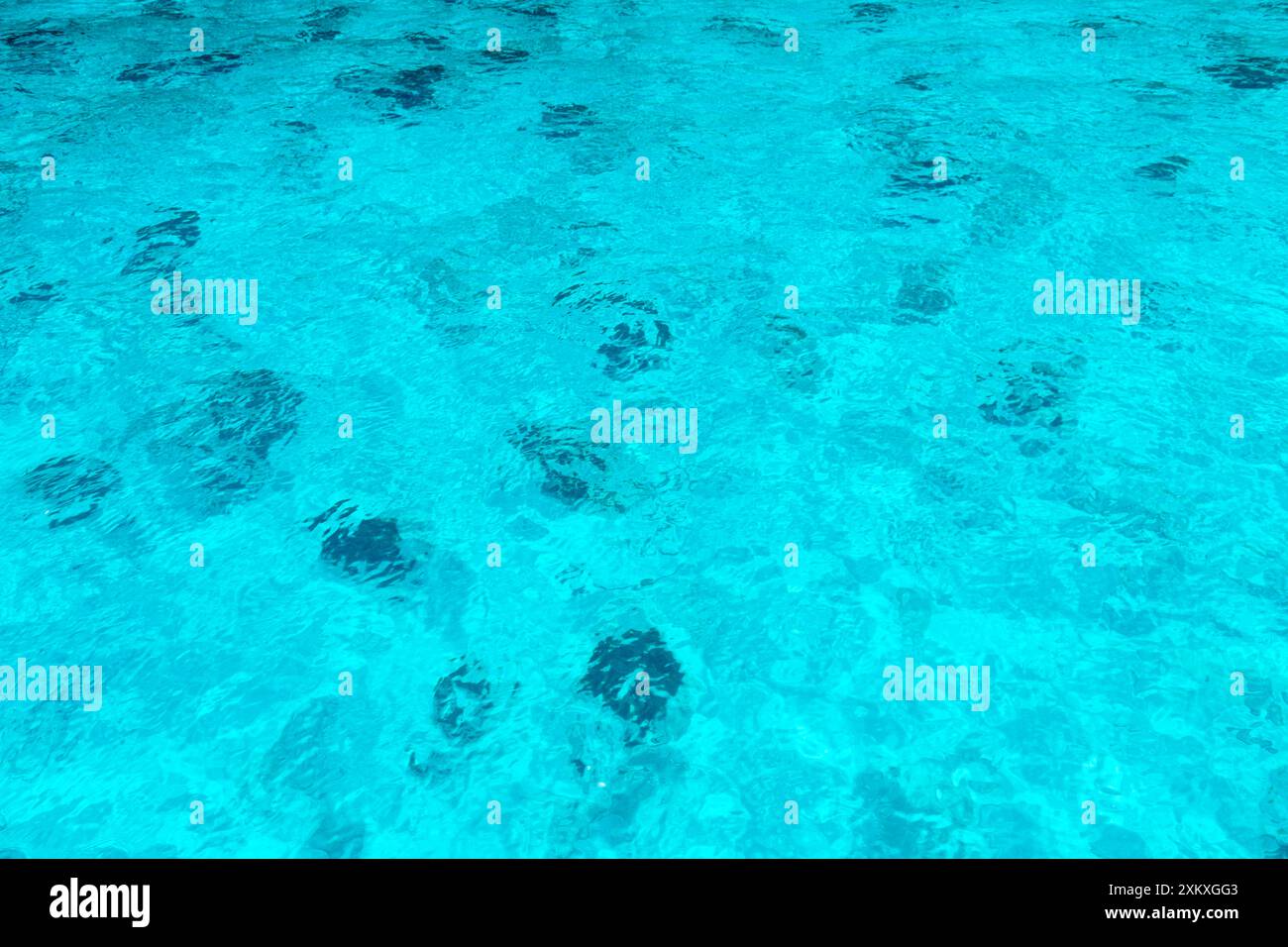 Texture of blue water under sun beams Stock Photo - Alamy