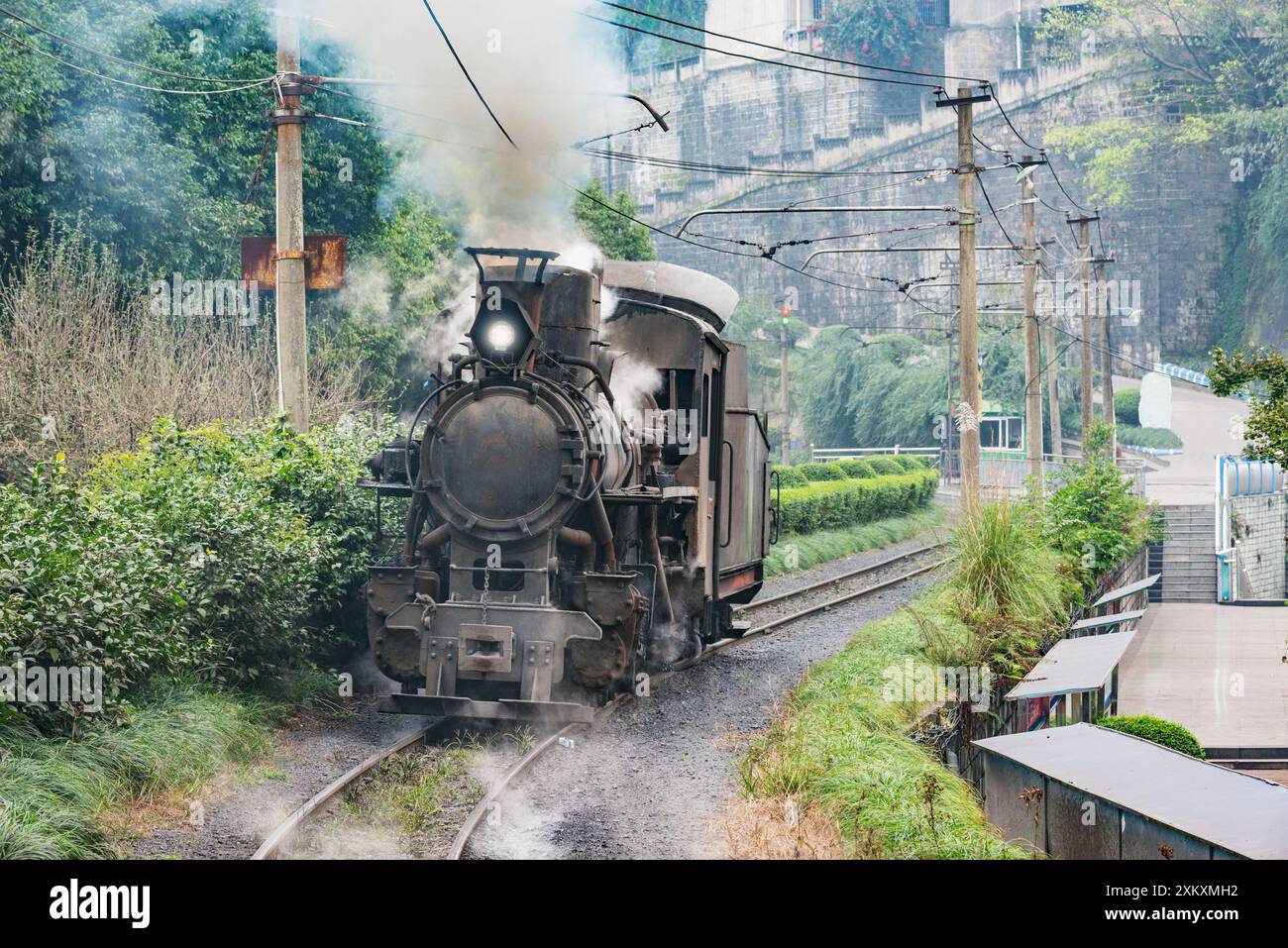 Steam narrow-gauge locomotive approaches to the station. Jiayang Mining ...