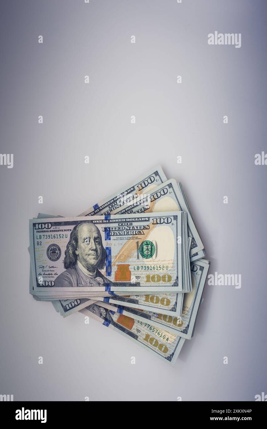 American 100 dollar banknote bundles placed on white background Stock ...