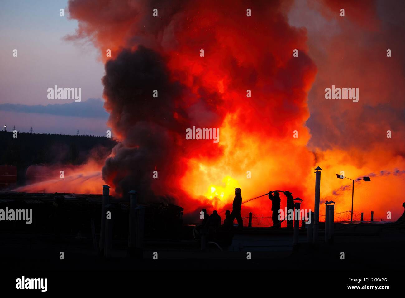 Large blaze at burning industrial building Stock Photo - Alamy