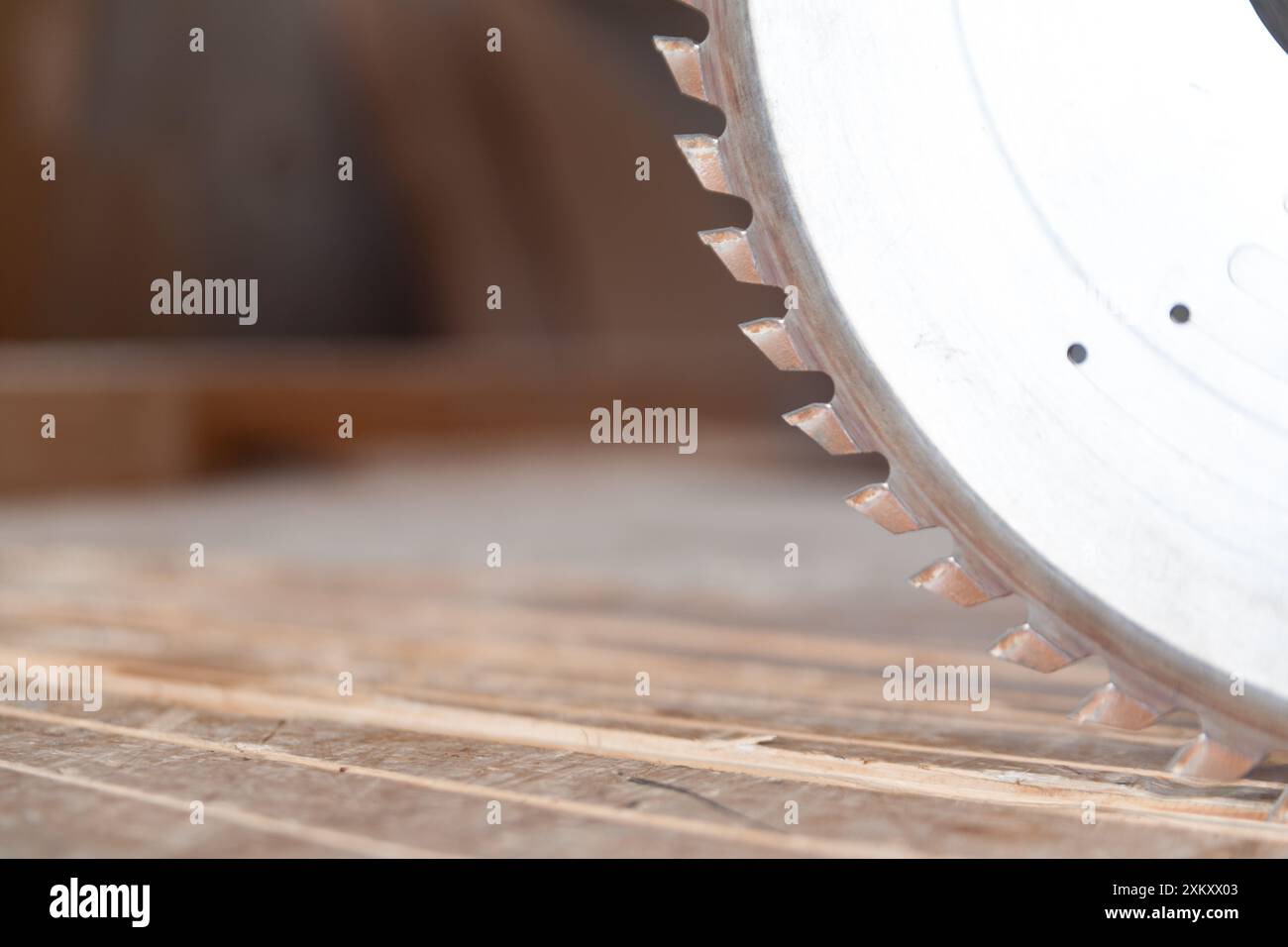 Precision cutting wood with circular saw blade in workshop, emphasizing ...