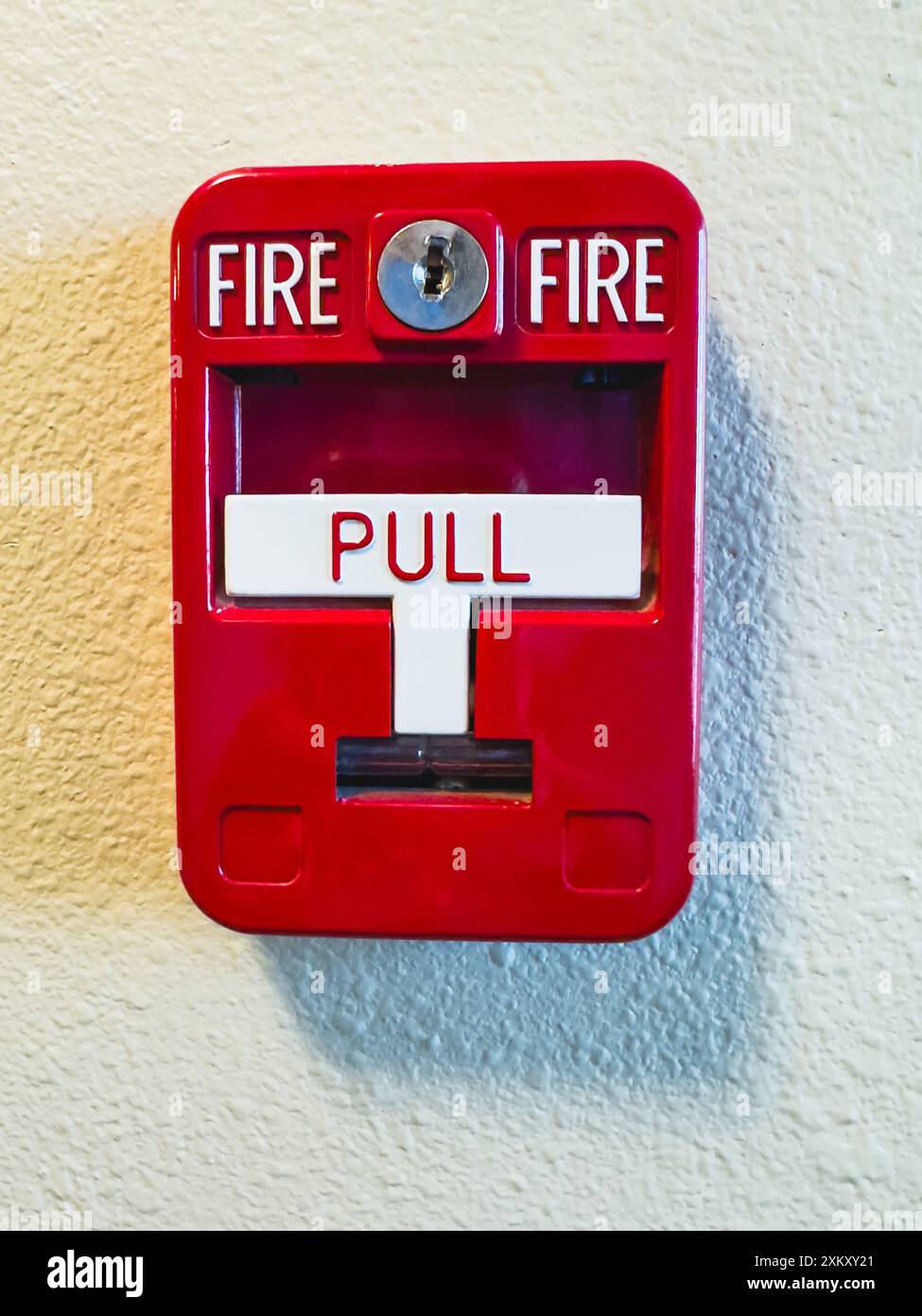 Red fire alarm box with "PULL" handle for emergencies, close-up Stock ...