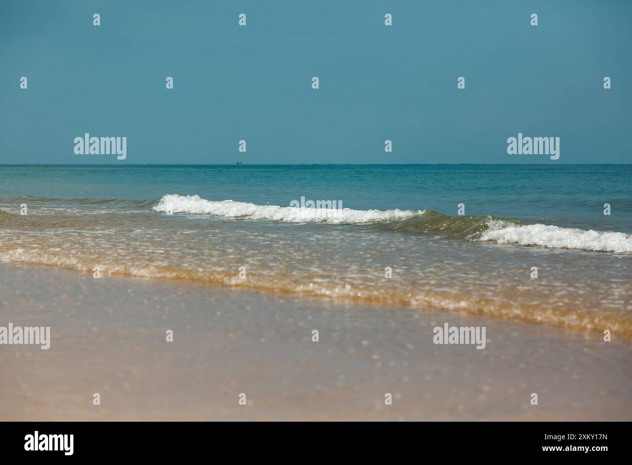 Little waves sliding toward the beach indicating persistence, peace and ...