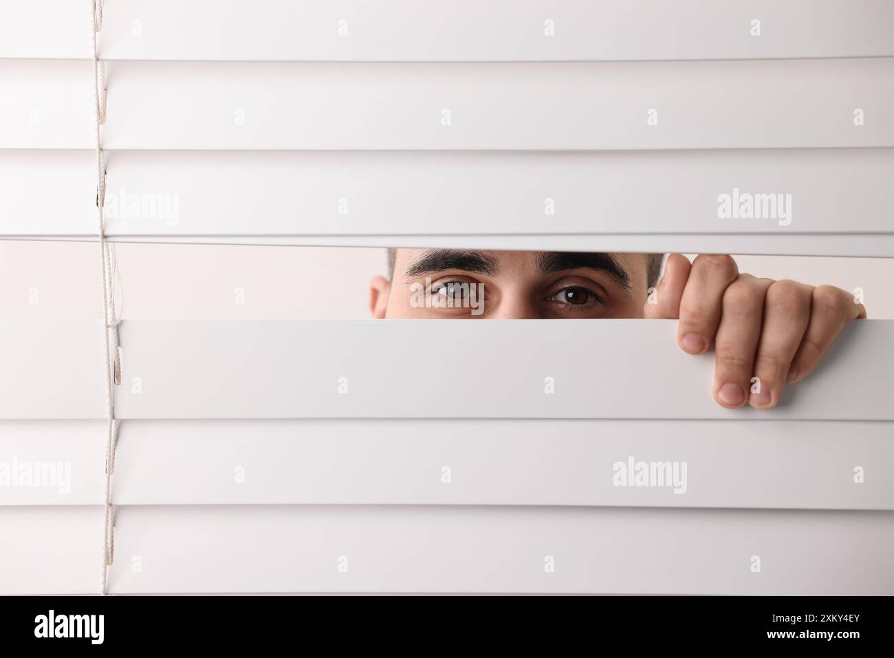 Man peeping through windows hi-res stock photography and images - Alamy