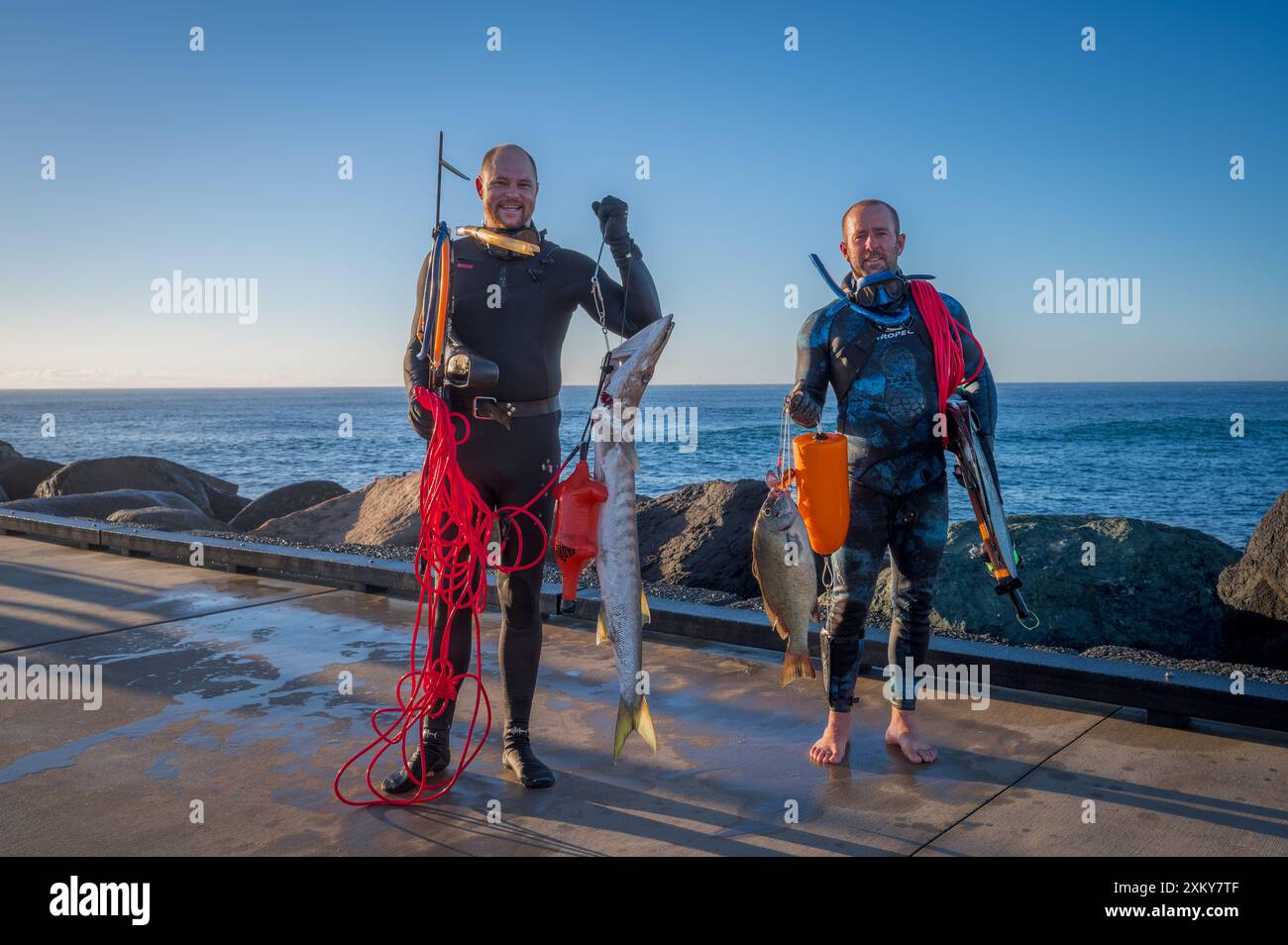 Two experienced spear fishermen stand on the 'Southport Spit' in ...