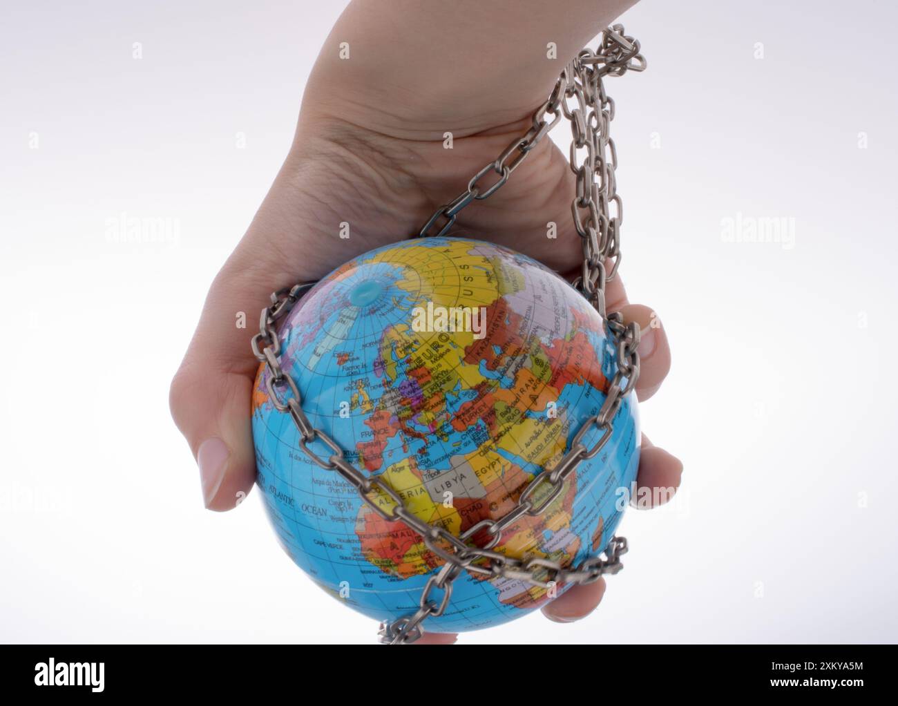 Globe in chain on a white background Stock Photo - Alamy