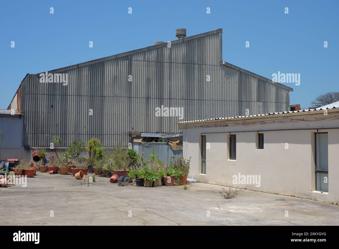 Industrial building made from corrugated asbestos sheet material ...