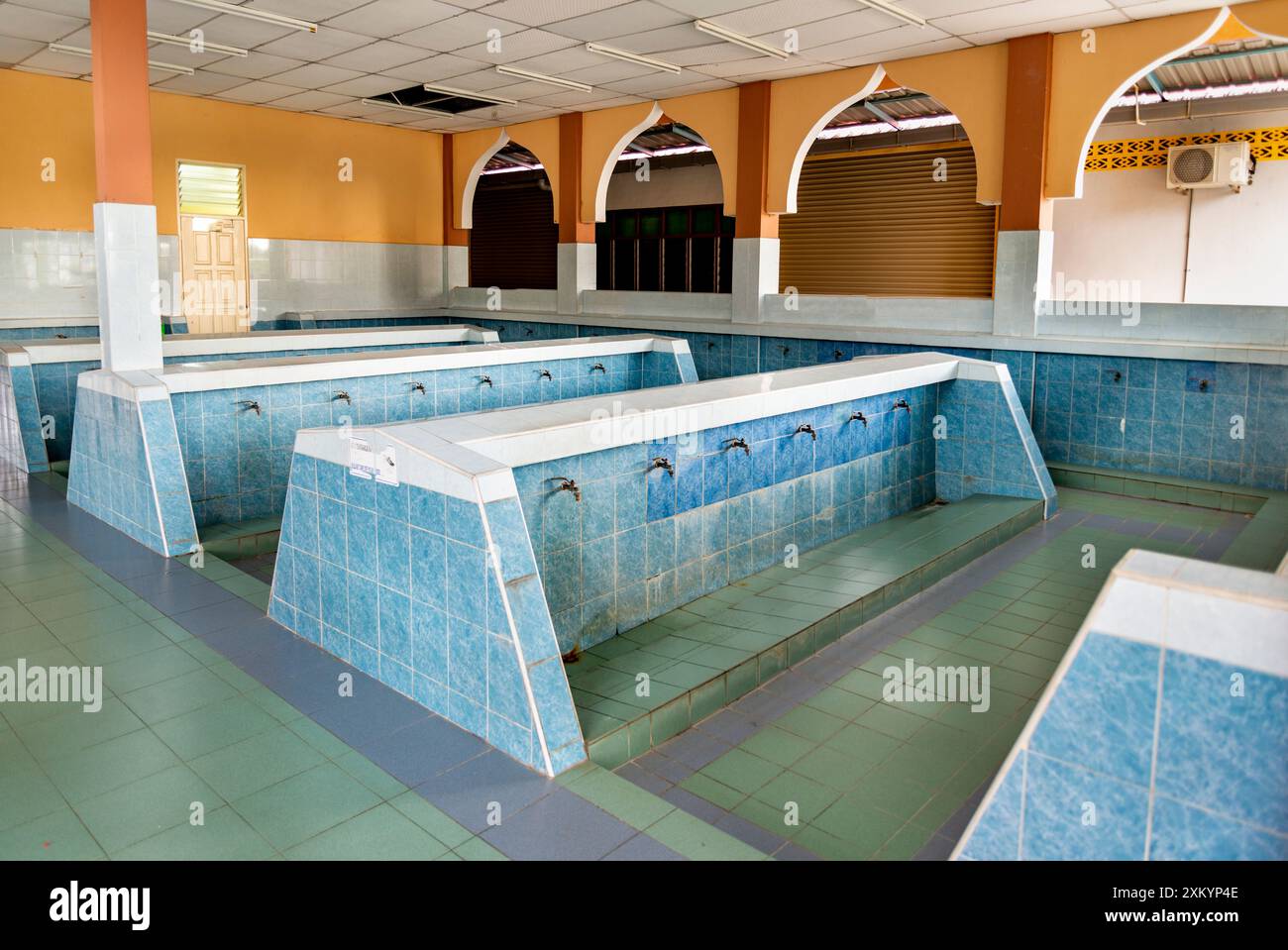A Wadhu facility, a dedicated area for ritual washing before prayer. an ...