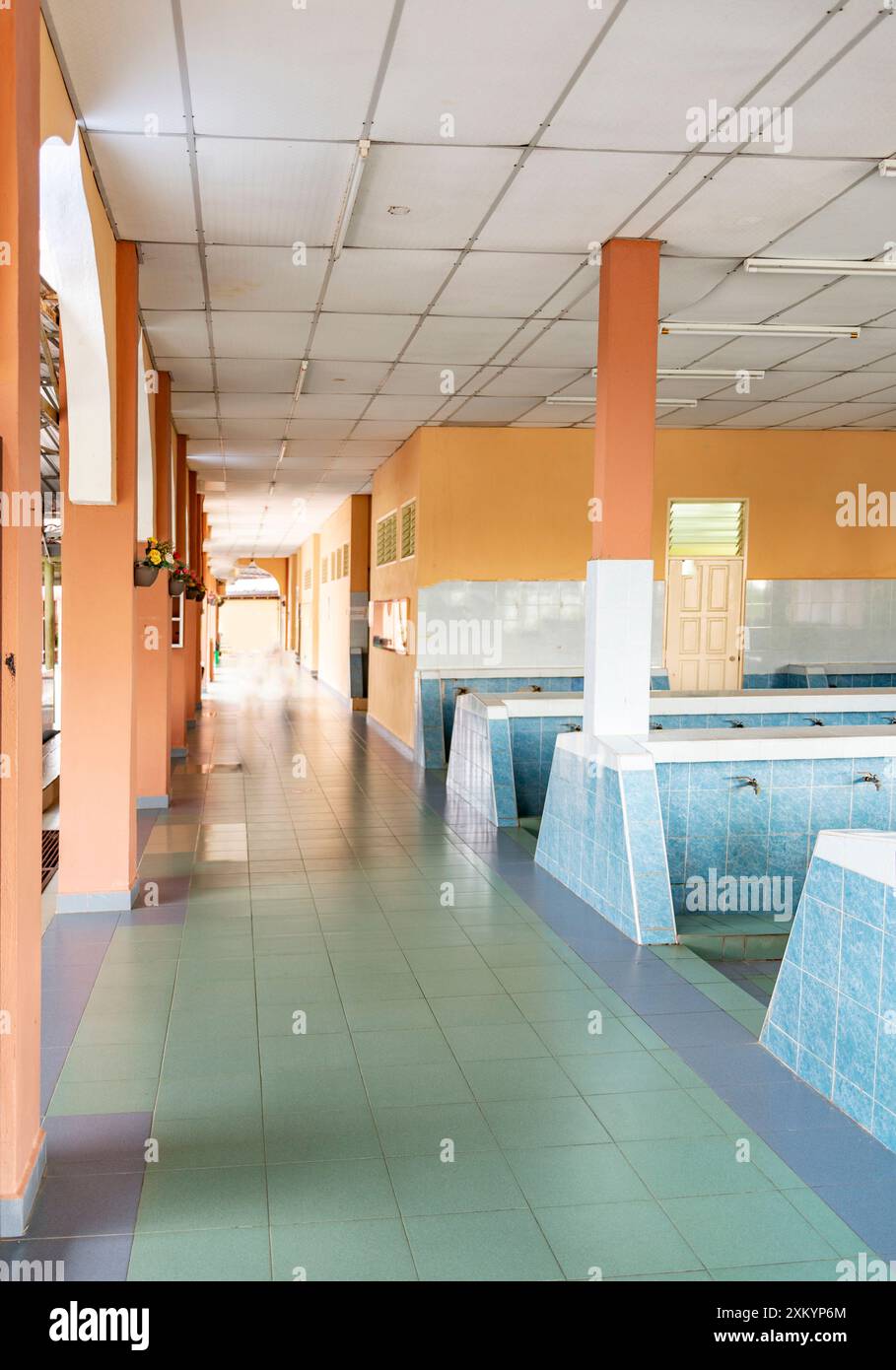 A Wadhu facility, a dedicated area for ritual washing before prayer. an ...