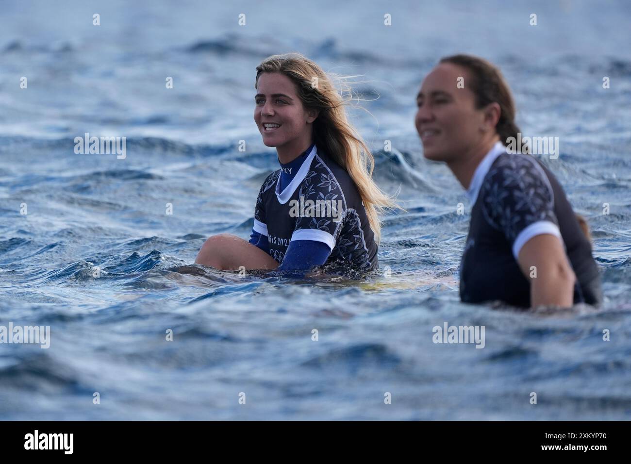 Caroline Marks, of the United States, left, watches the lineup ...