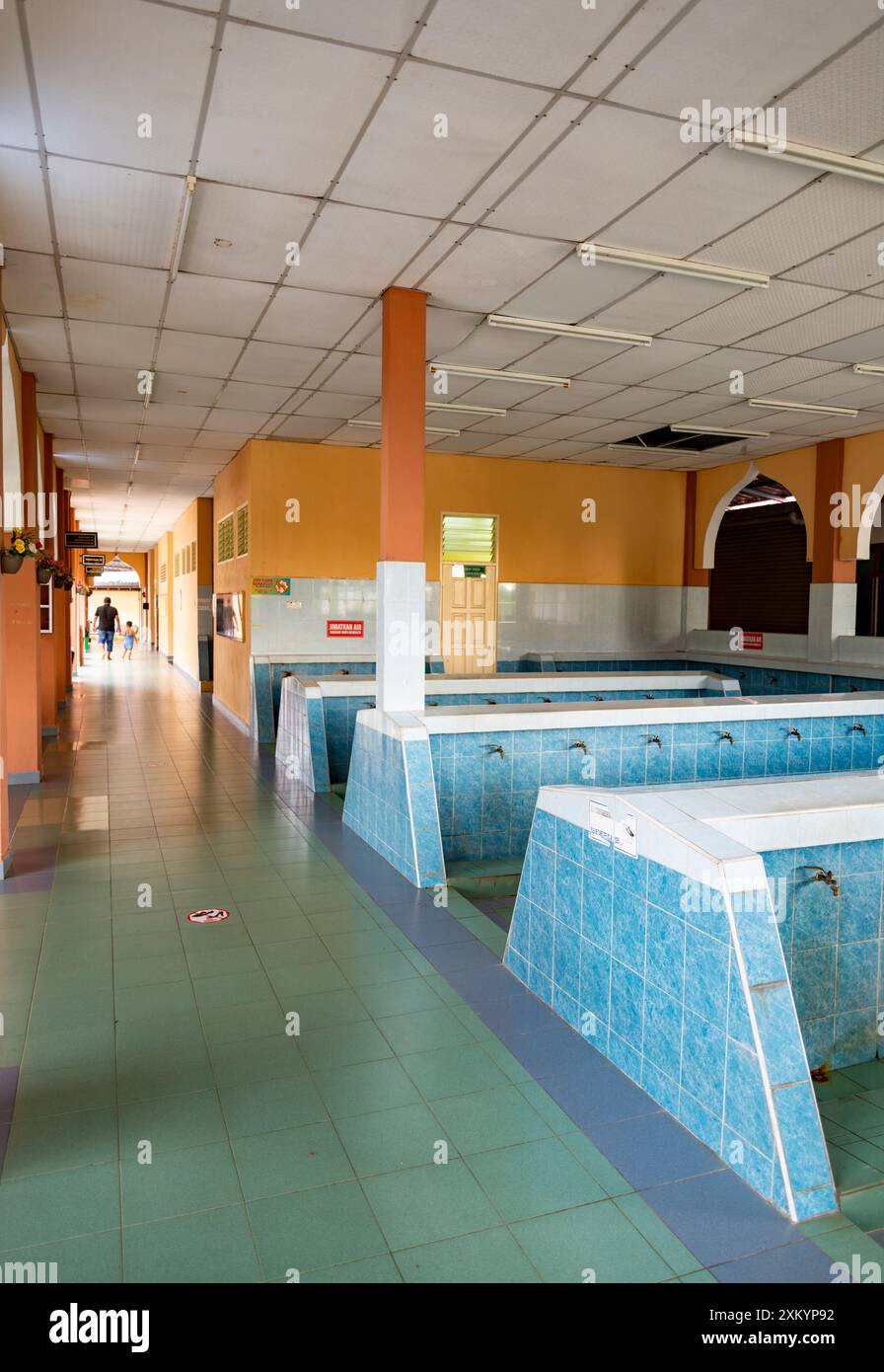 A Wadhu facility, a dedicated area for ritual washing before prayer. an ...