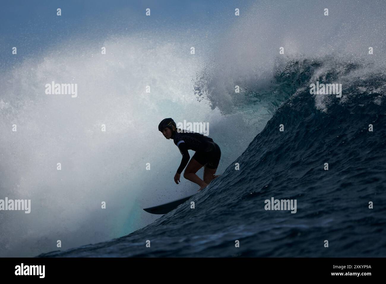 Caitlin Simmers, of the United States, surfs during a training day ...