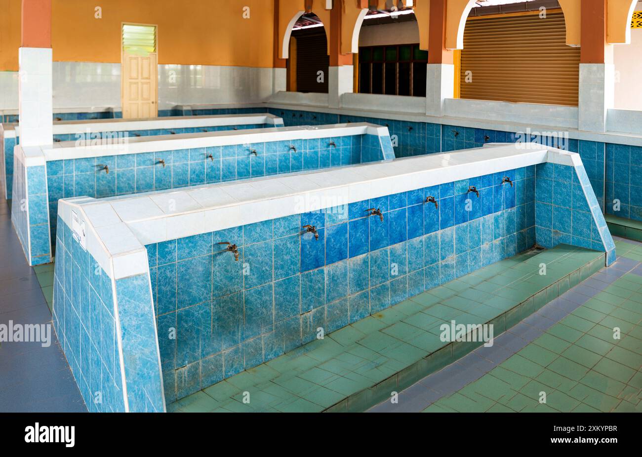 A Wadhu facility, a dedicated area for ritual washing before prayer. an ...