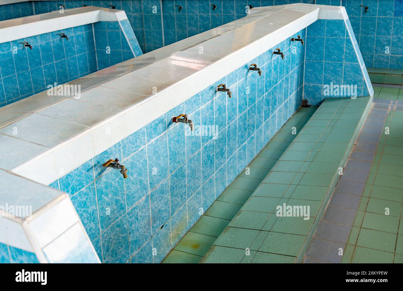 A Wadhu facility, a dedicated area for ritual washing before prayer. an ...