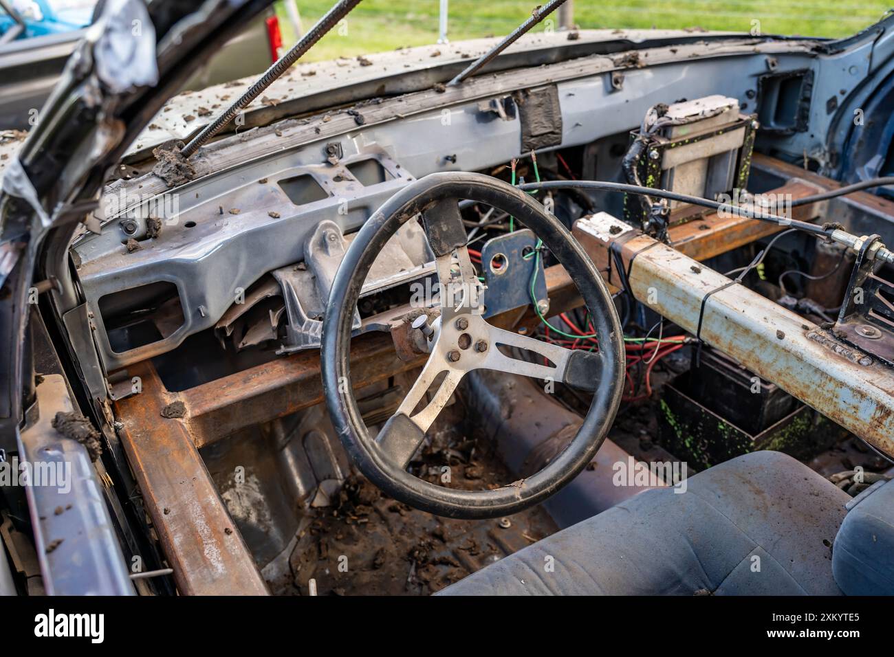 Steering wheel, structural support, and stripped interior of a ...