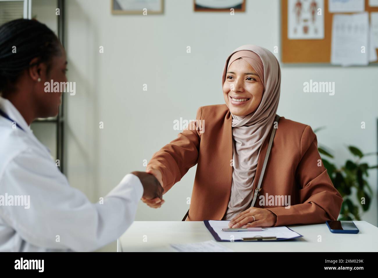 Young muslim female patient signing hi-res stock photography and images ...