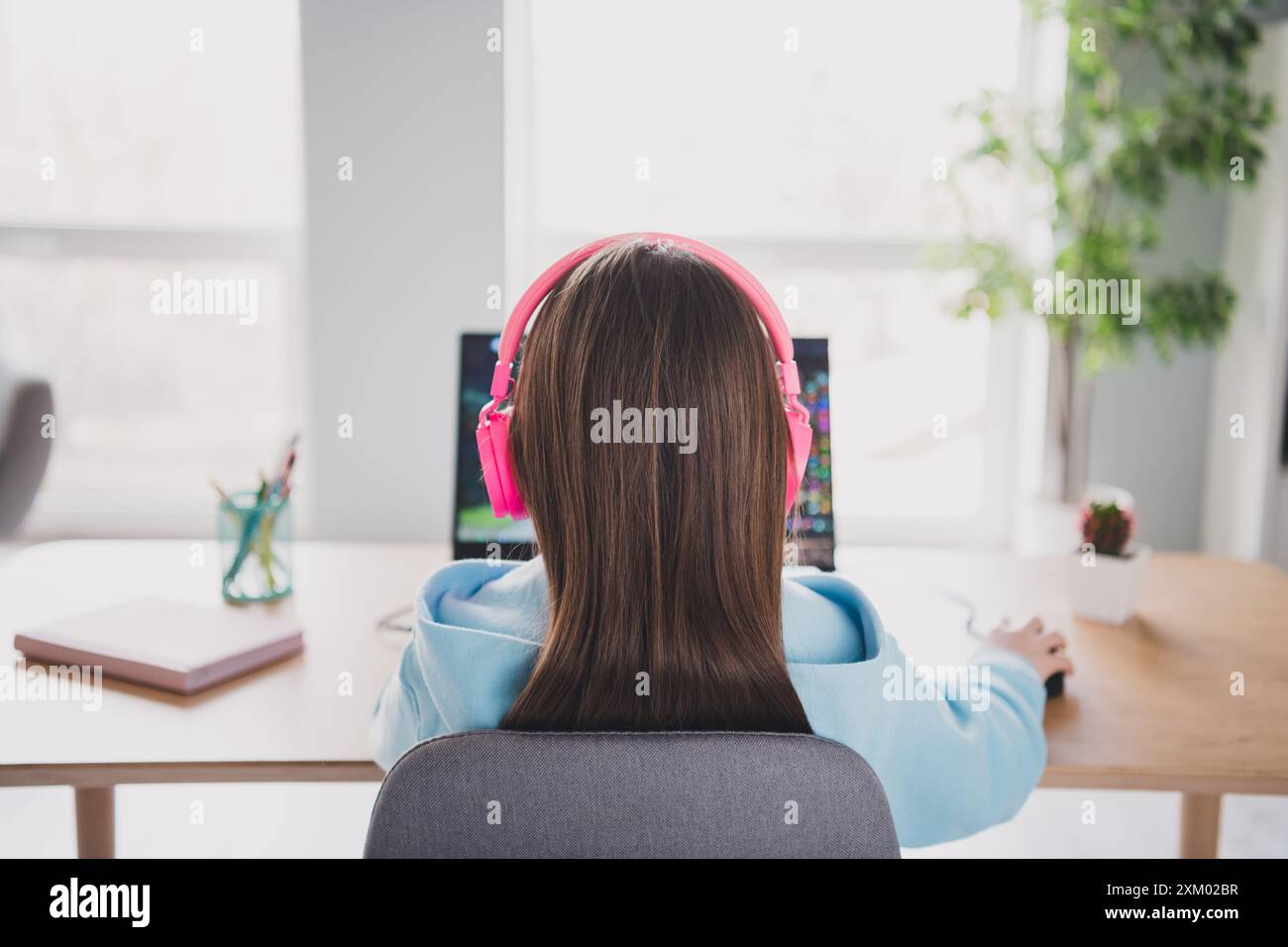 Rear side photo of cute lovely adorable girl little gamer playing ...