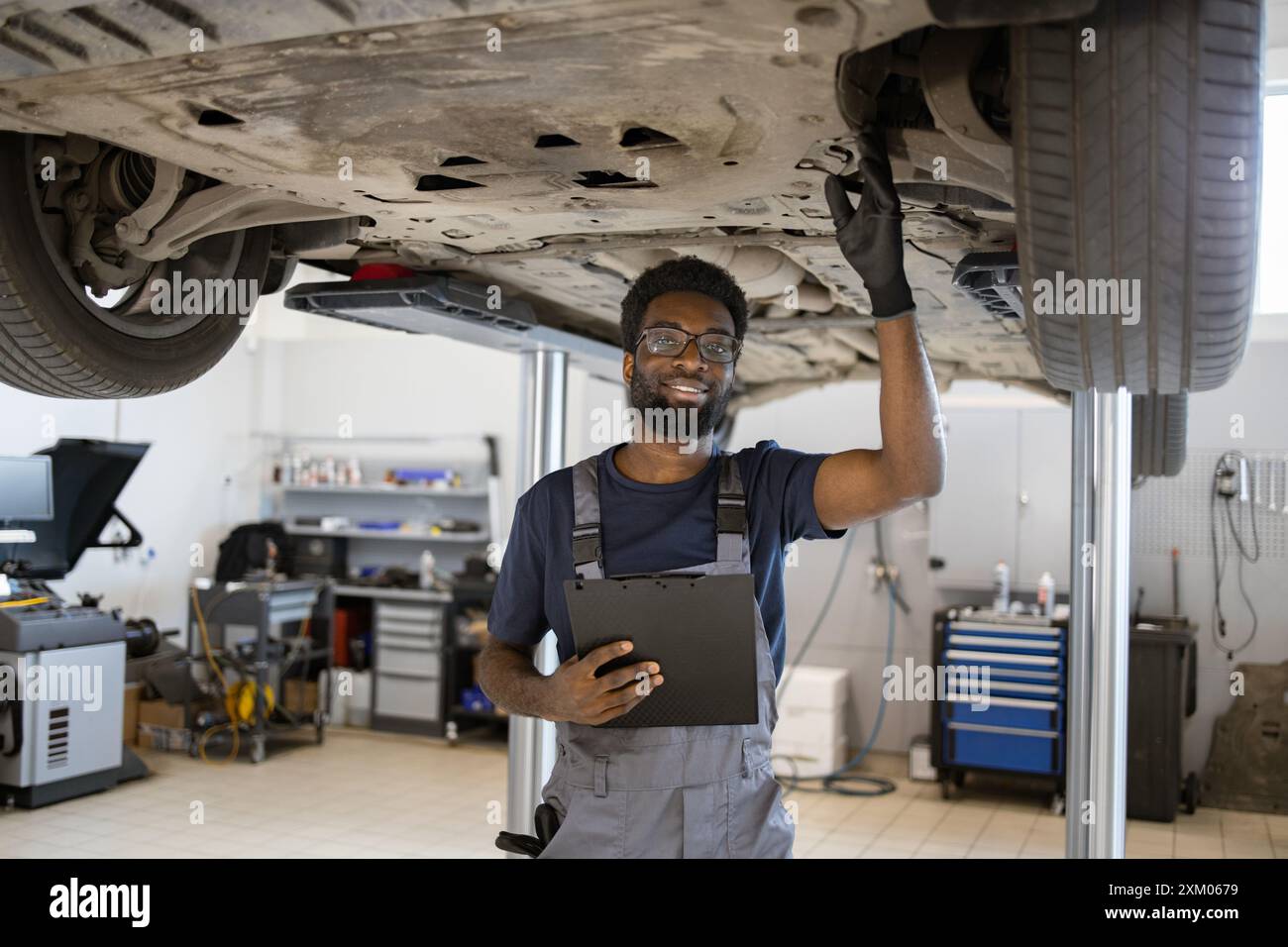 African mechanic under car hi-res stock photography and images - Alamy