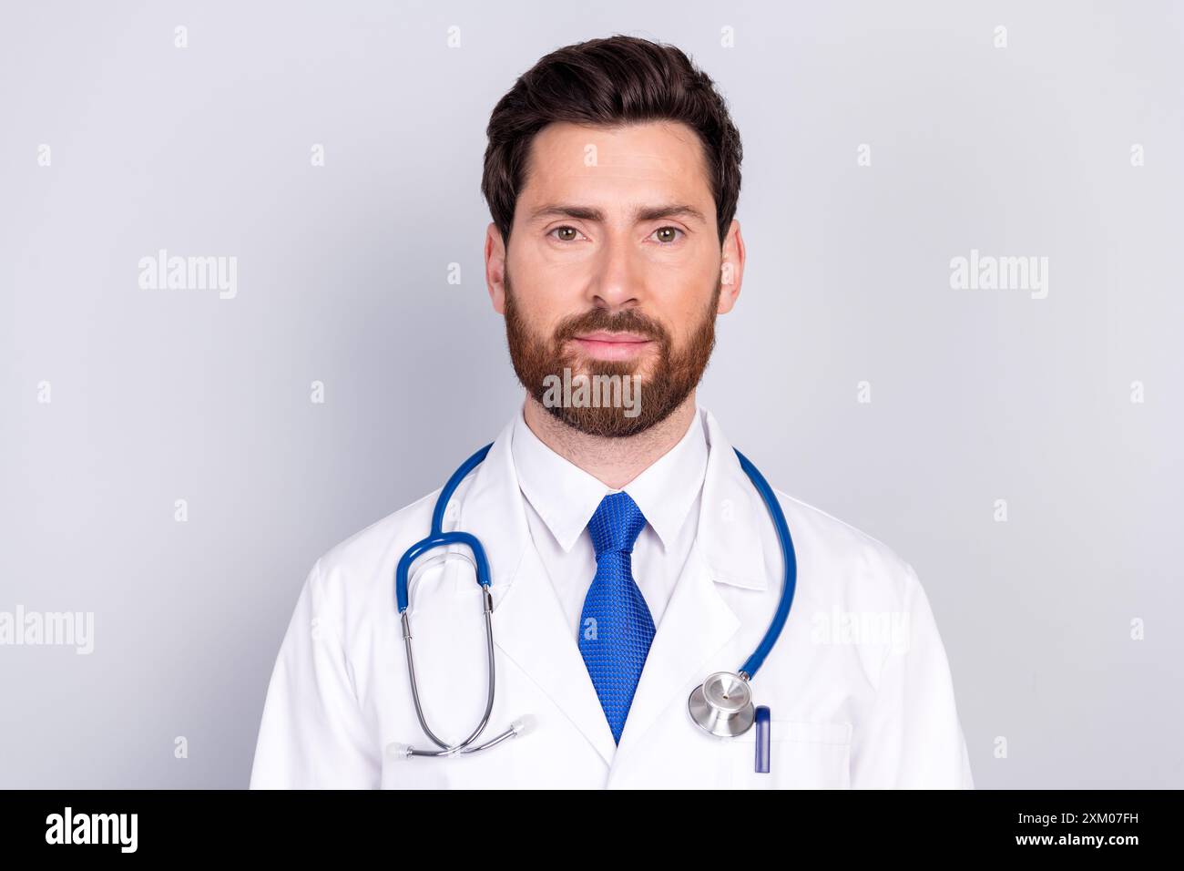 Photo of professional doctor man wear white coat isolated on grey color ...